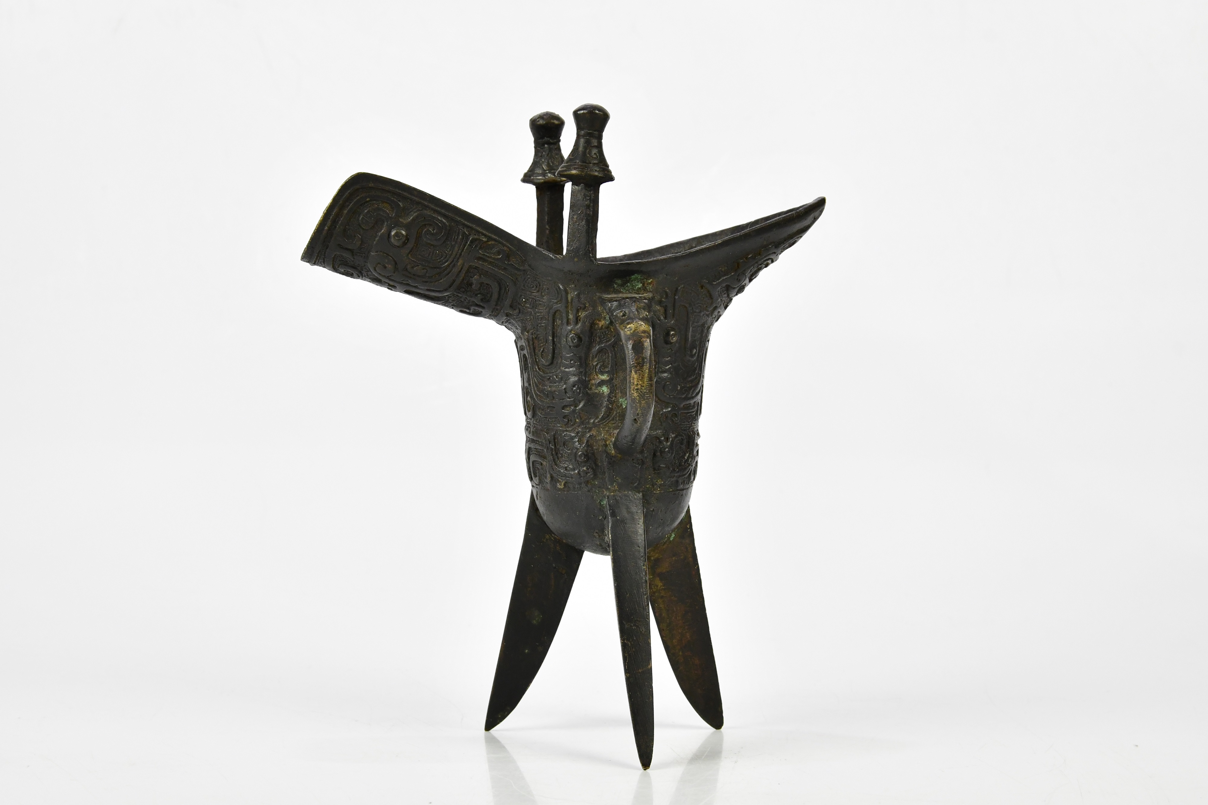 Lot 1129 - A Chinese bronze jue of archaic form,