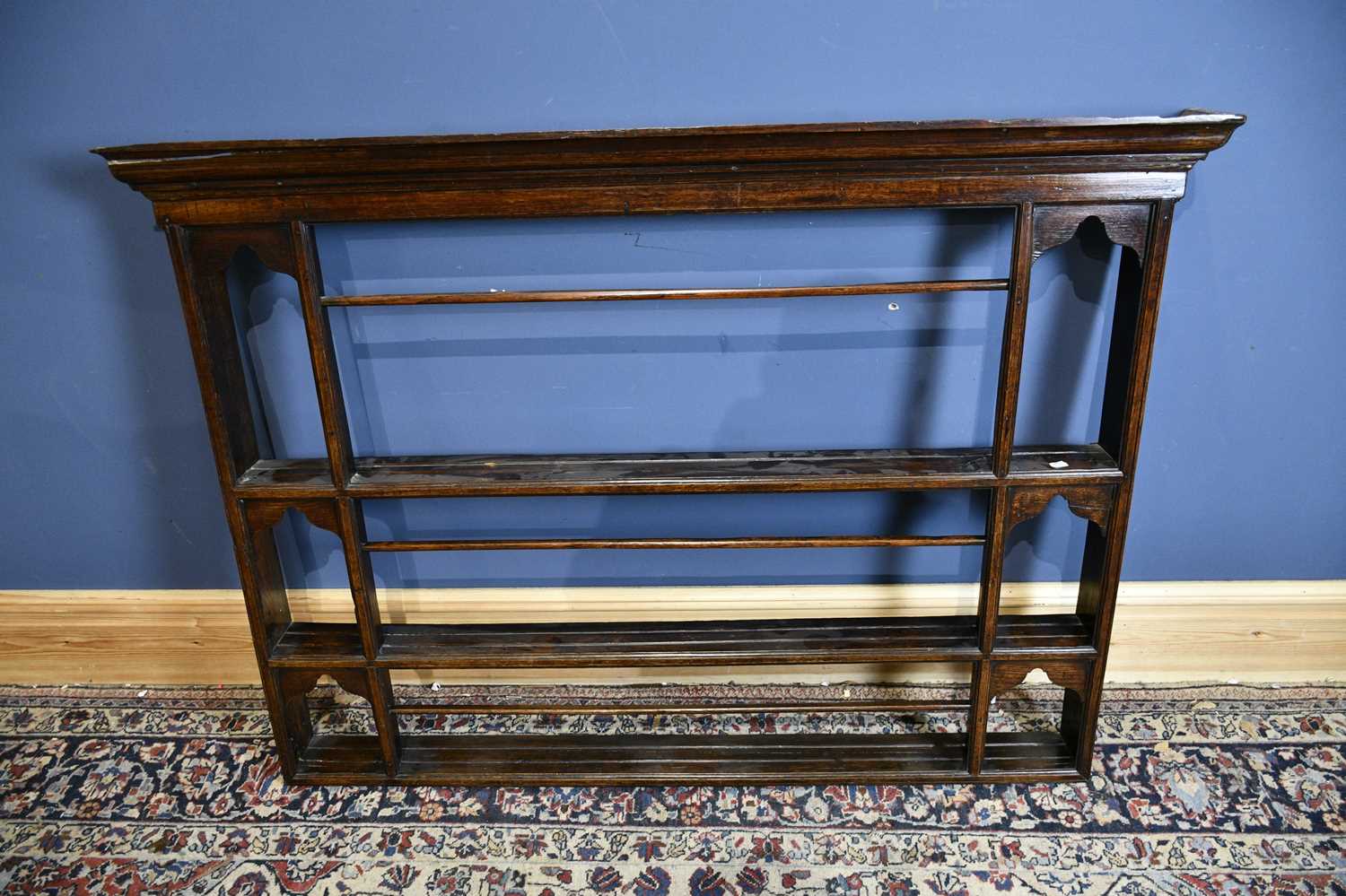 Lot 6537 - An 18th century oak wall mounted open plate