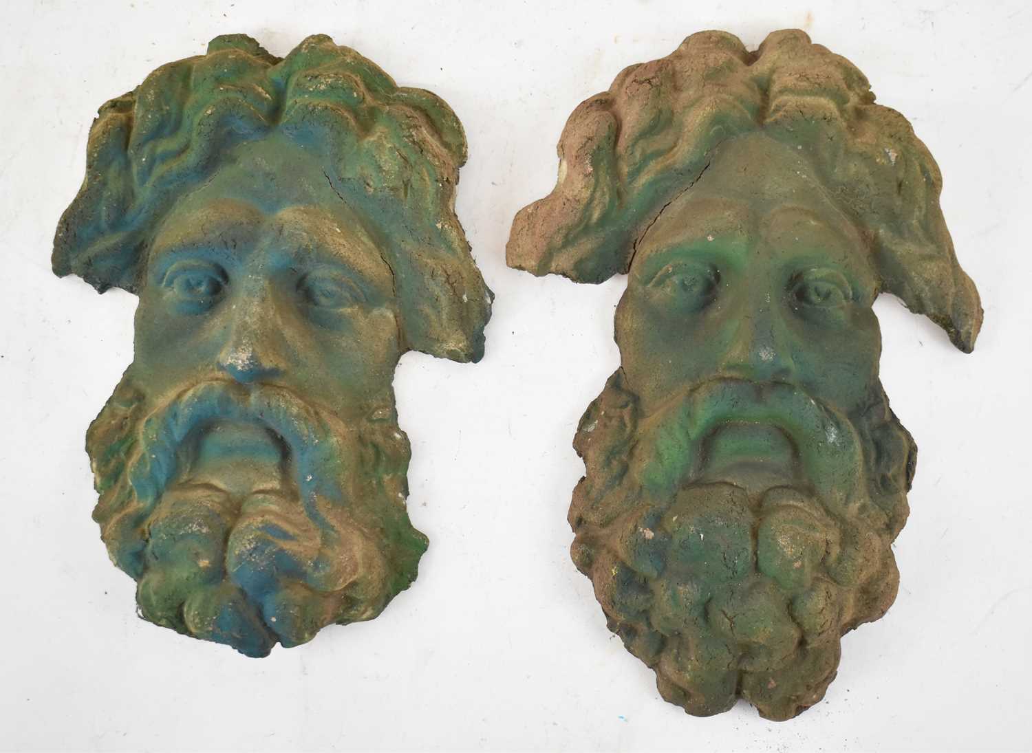 Lot 154 - Two decorative stone wall masks, depicting