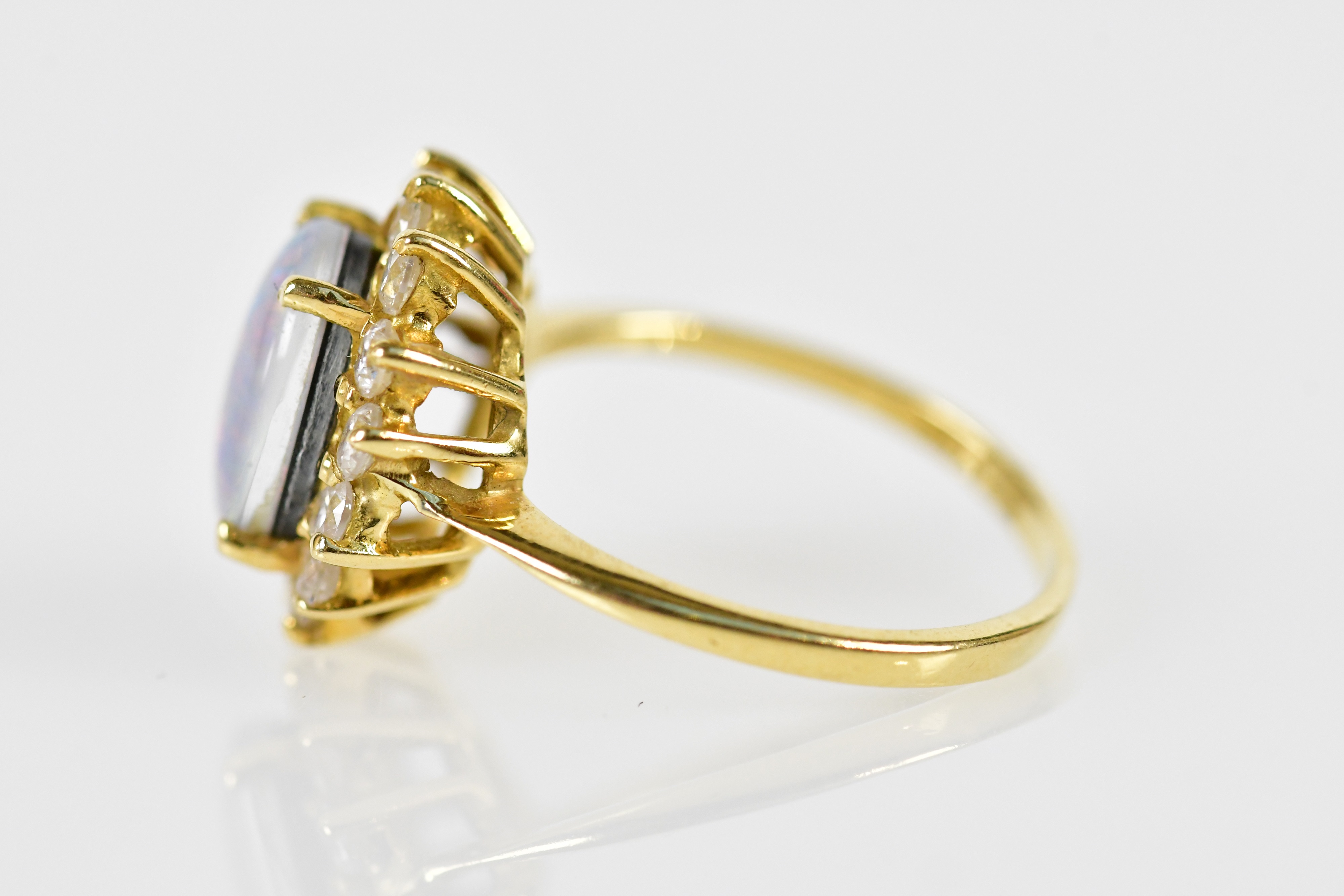 Lot 182 - An 18ct yellow gold doublet opal and diamond