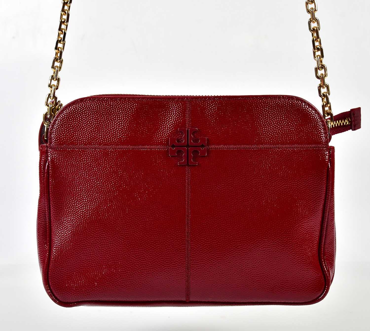 Lot 869 - TORY BURCH; a red pebbled patent leather