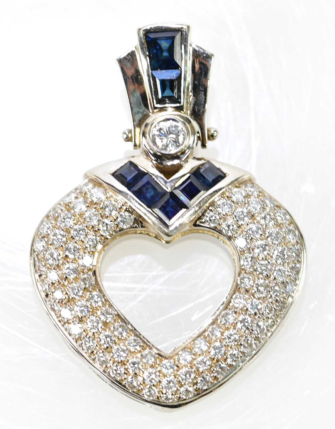 Lot 318 - An 18ct white gold pave diamond set heart