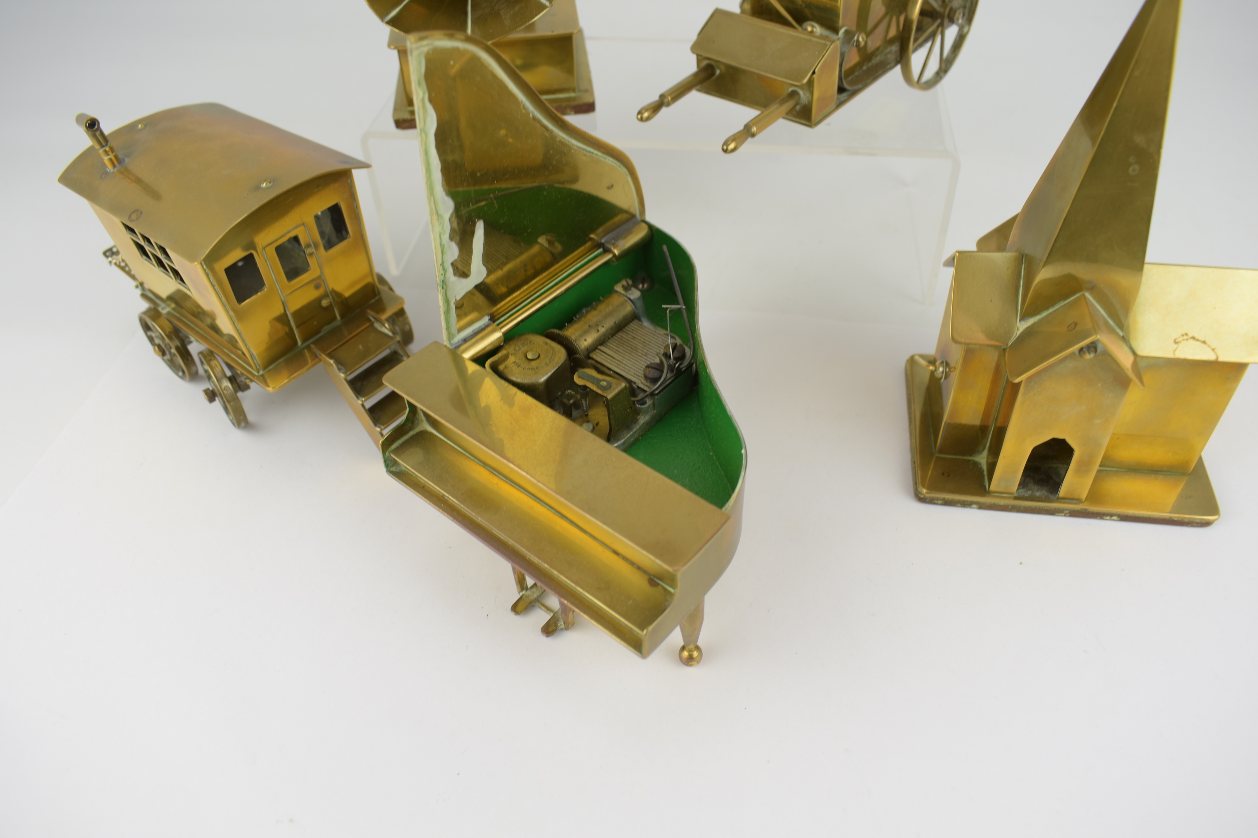 Lot 144 - Five scratch-built brass model ornaments,