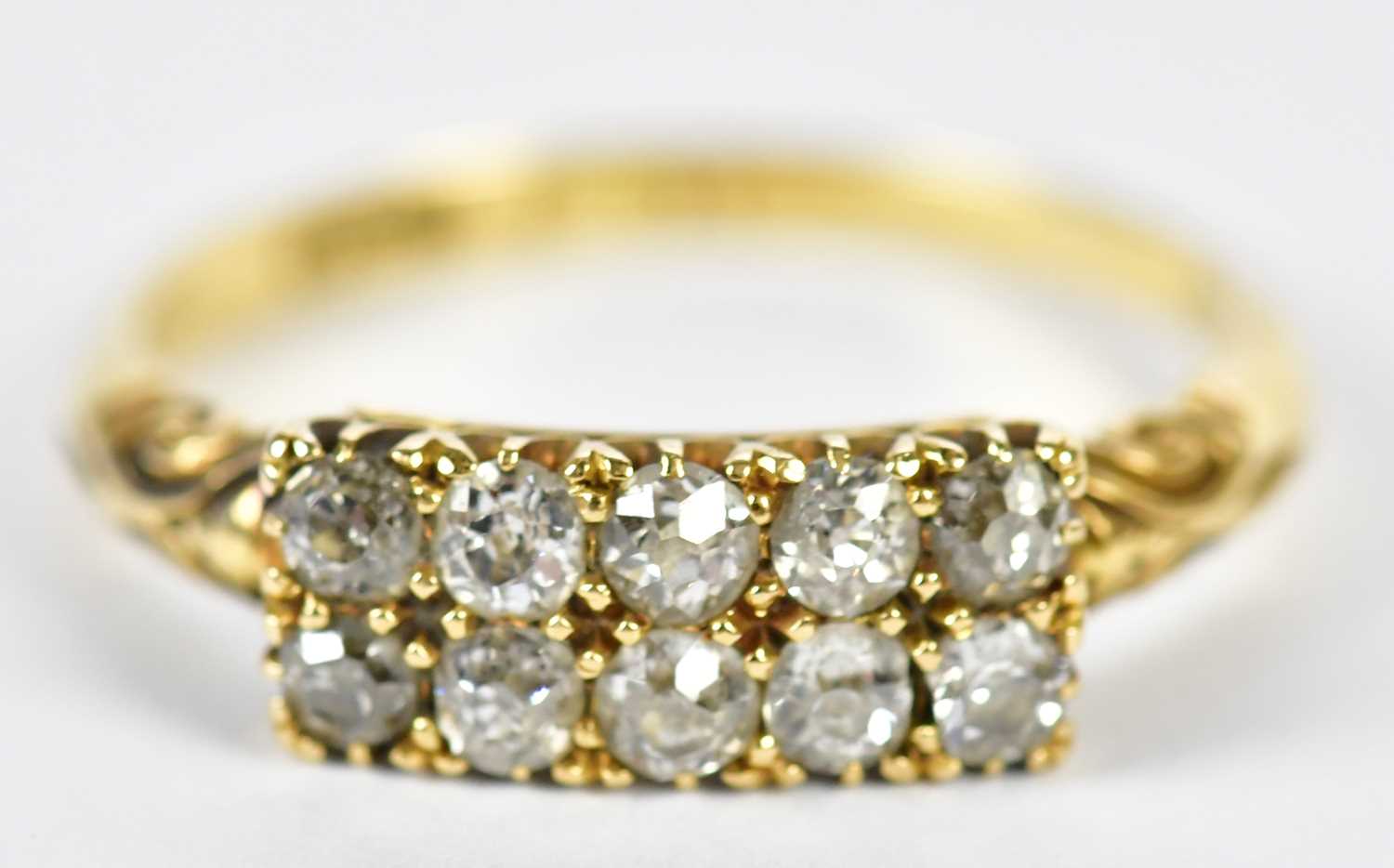 Lot 133 - An 18ct yellow gold diamond ten stone ring,