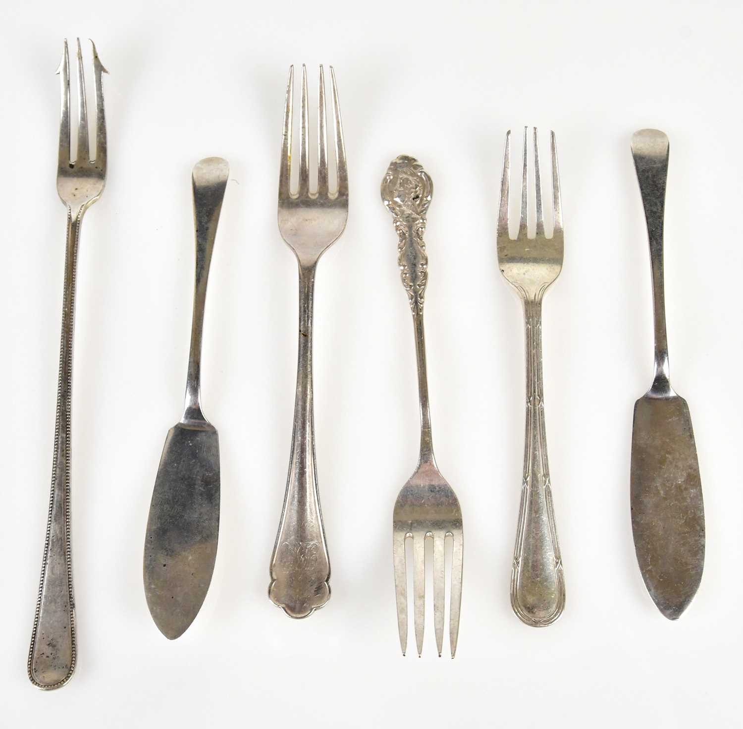Lot 2461 - Four various hallmarked silver forks, and a