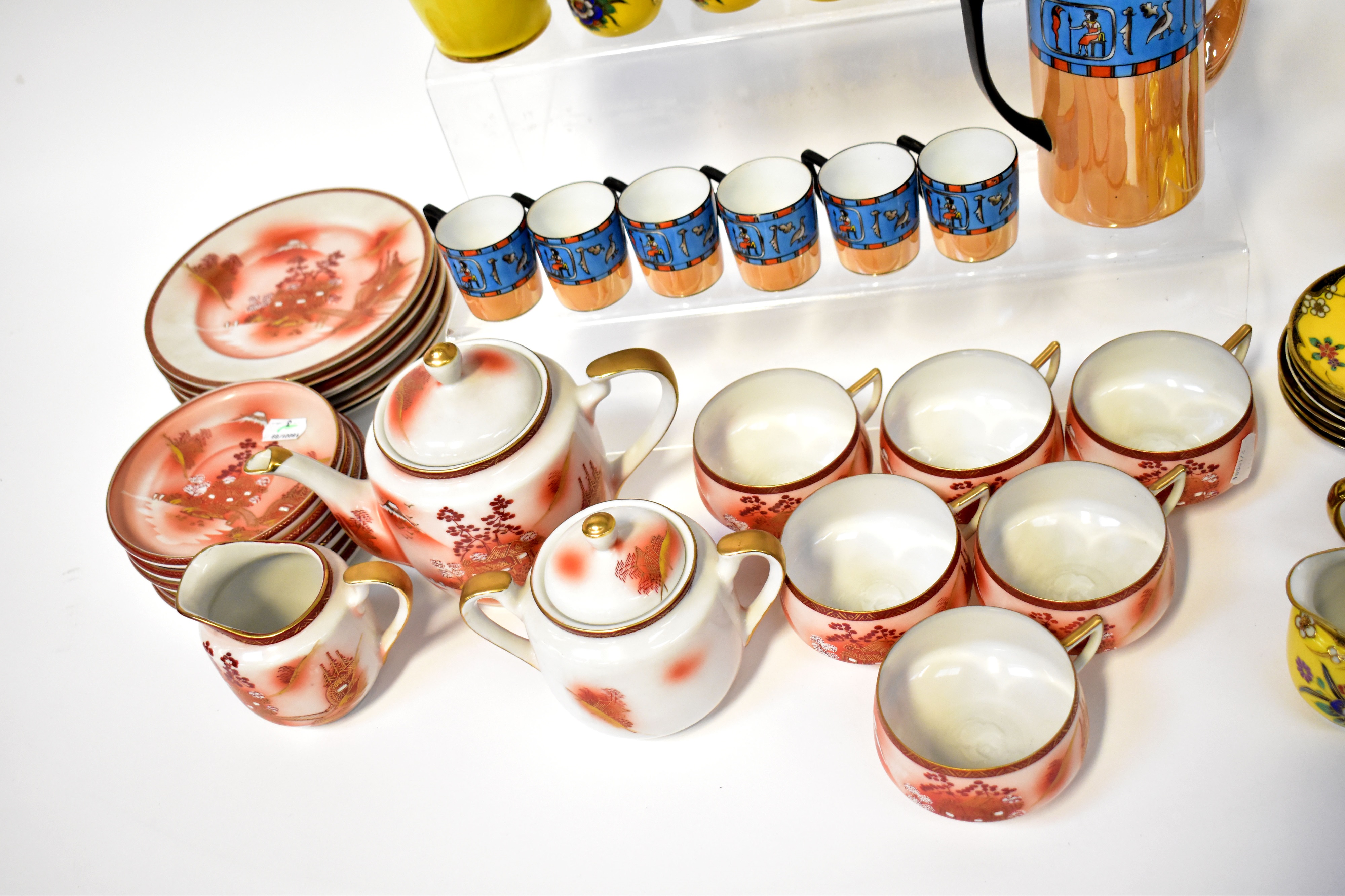 Lot 385 - A Japanese geisha eggshell tea set