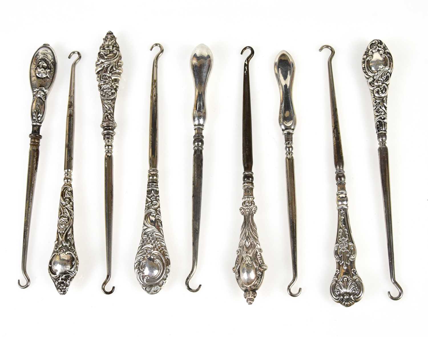 Lot 2492 - Nine hallmarked silver handled button hooks,
