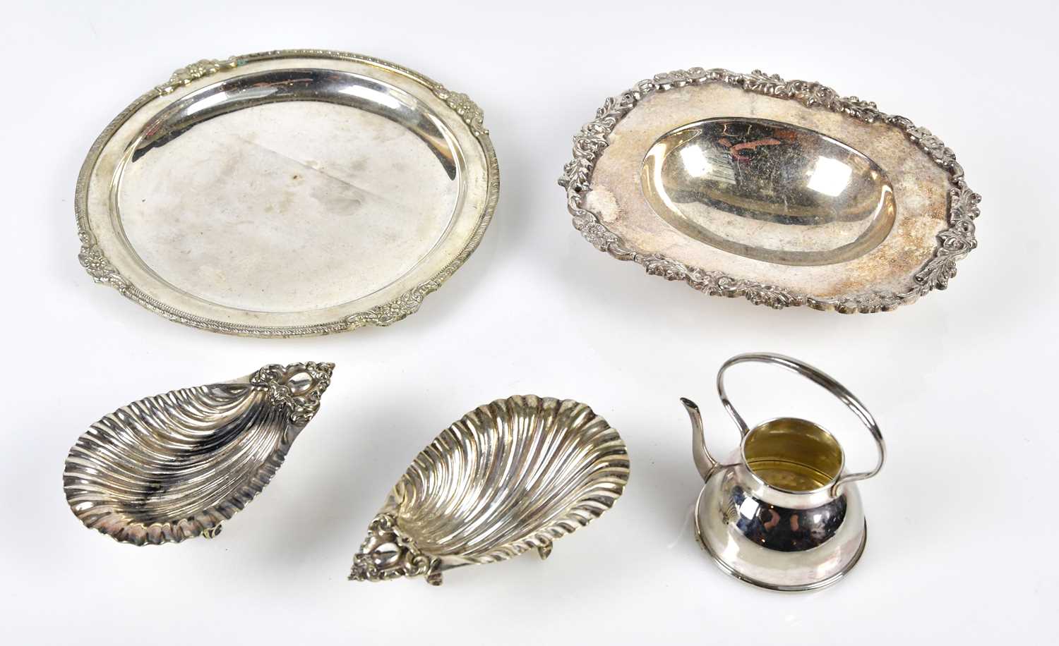 Lot 2804 - A white metal dish with cast beaded rim, a