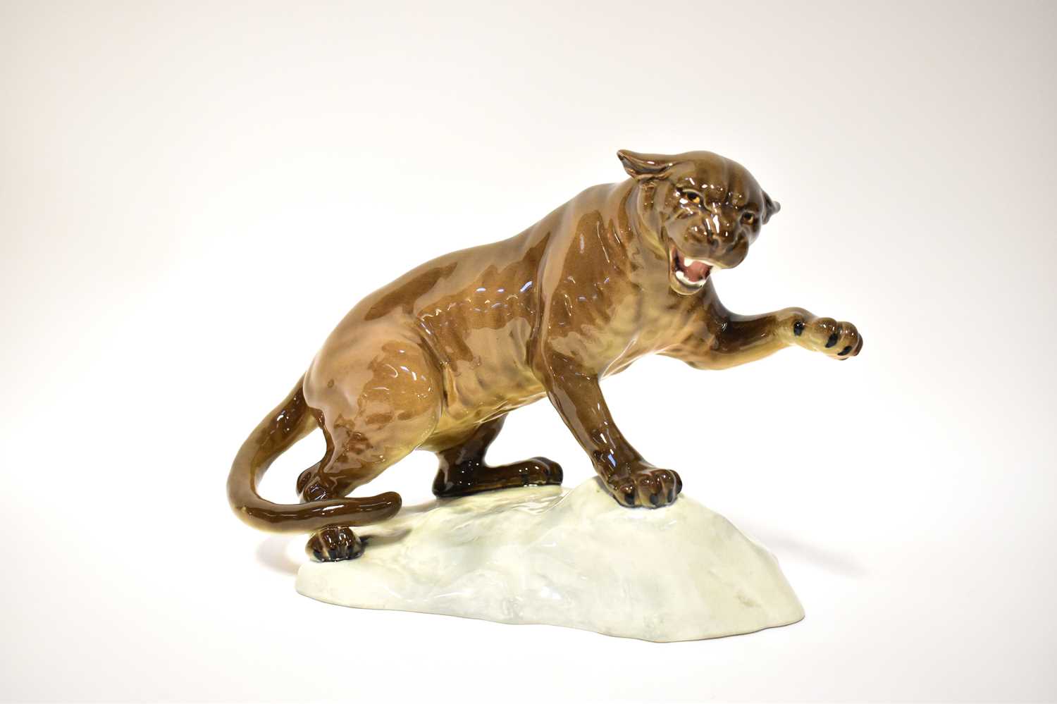 Lot 334 - BESWICK; a puma on rocky outcrop, blind