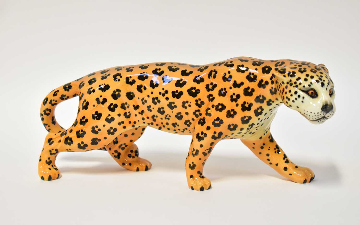 Lot 551 - BESWICK; a figure of a leopard.