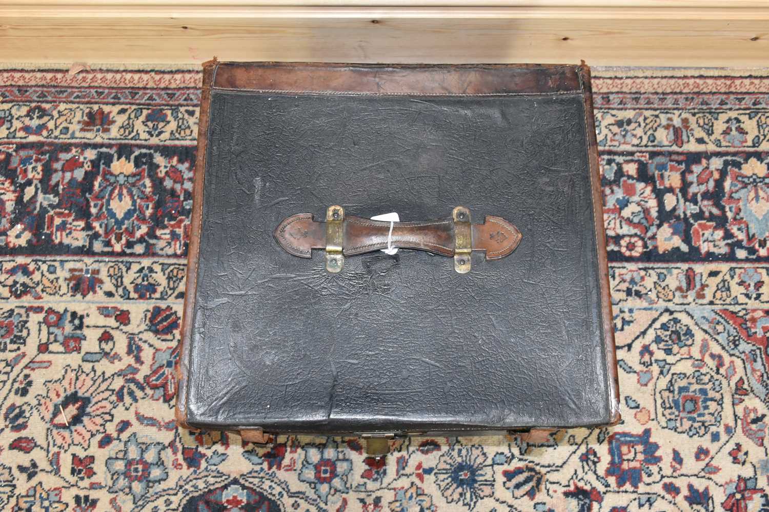 Lot 777 - A late 19th century black leather steamer