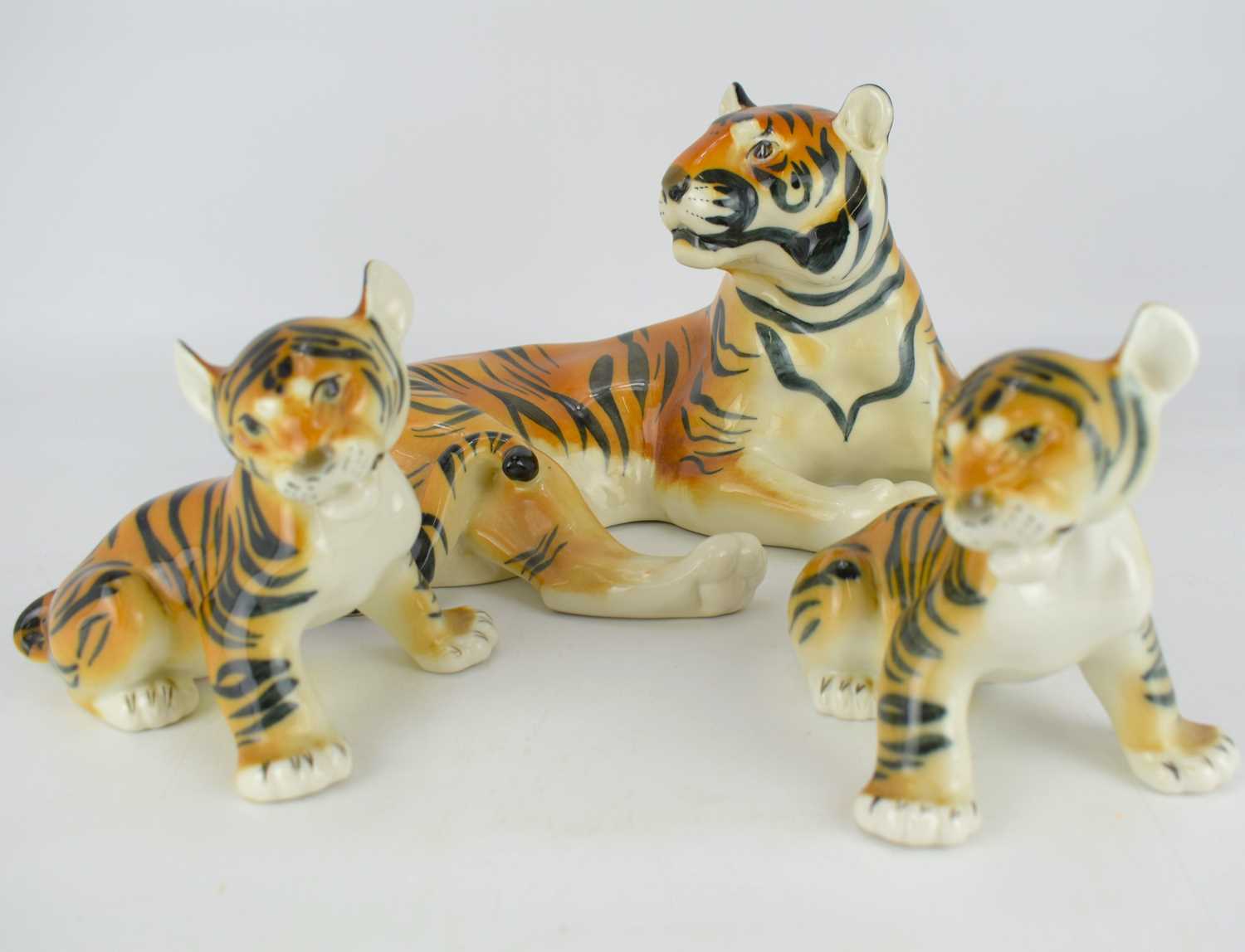 Lot 628 - USSR PORCELAIN; a resting tiger with two
