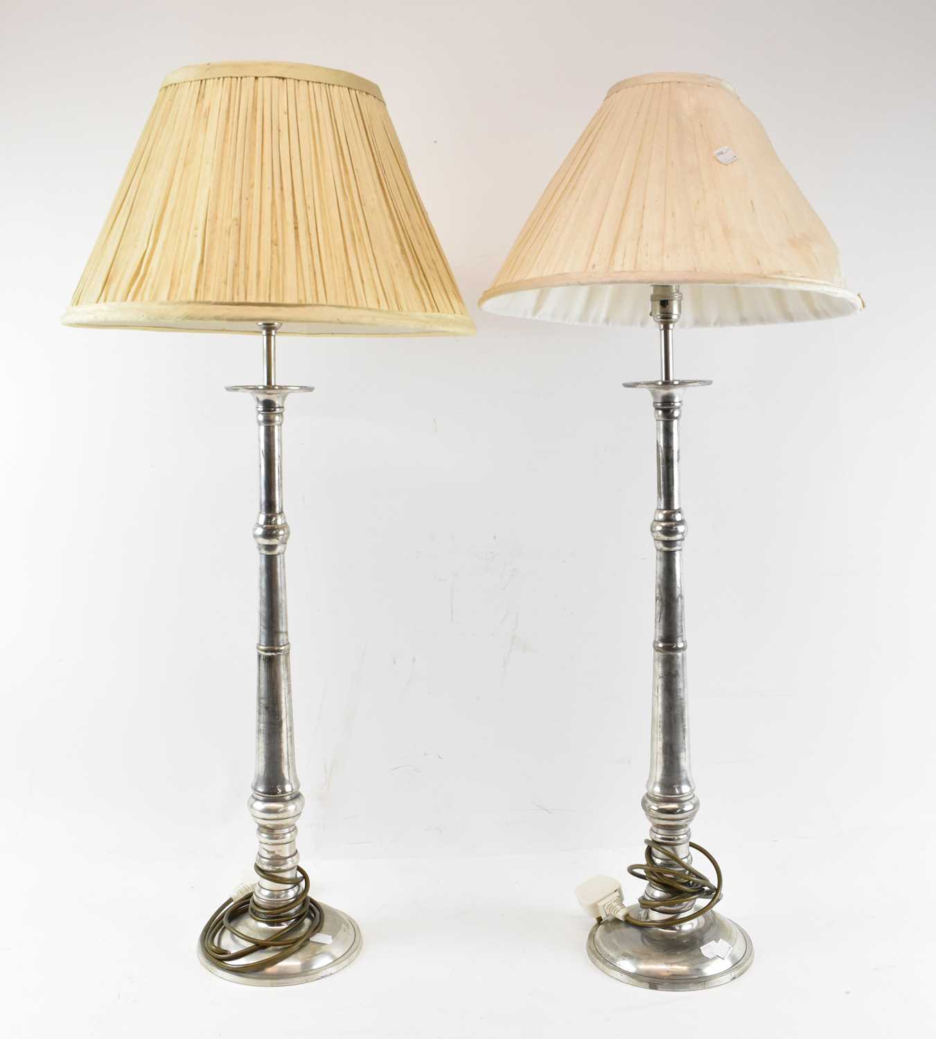 Lot 130 - A pair of modern stainless steel table lamps