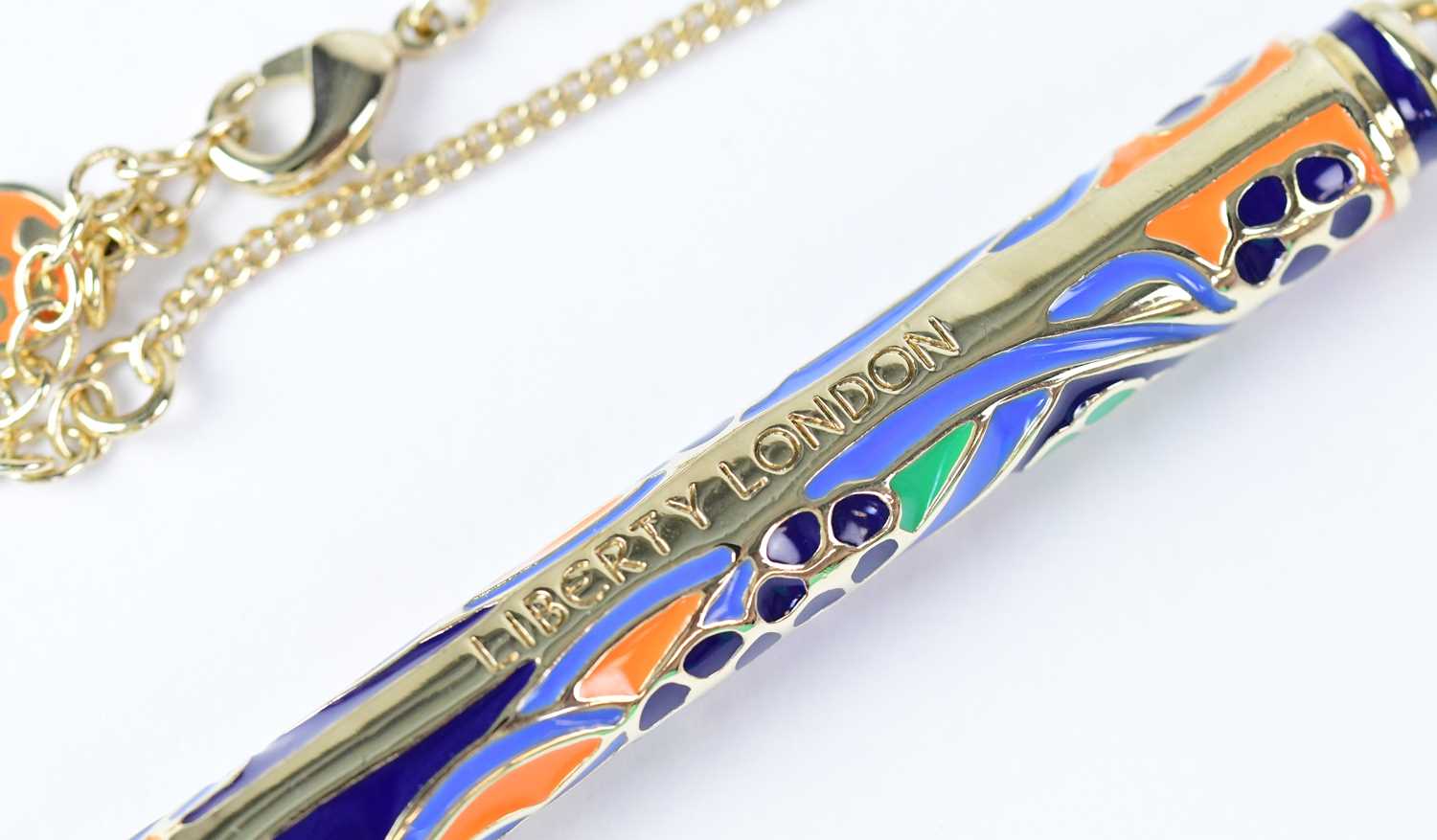 Lot 1075 - LIBERTY; a boxed lanthe enamelled pendant,