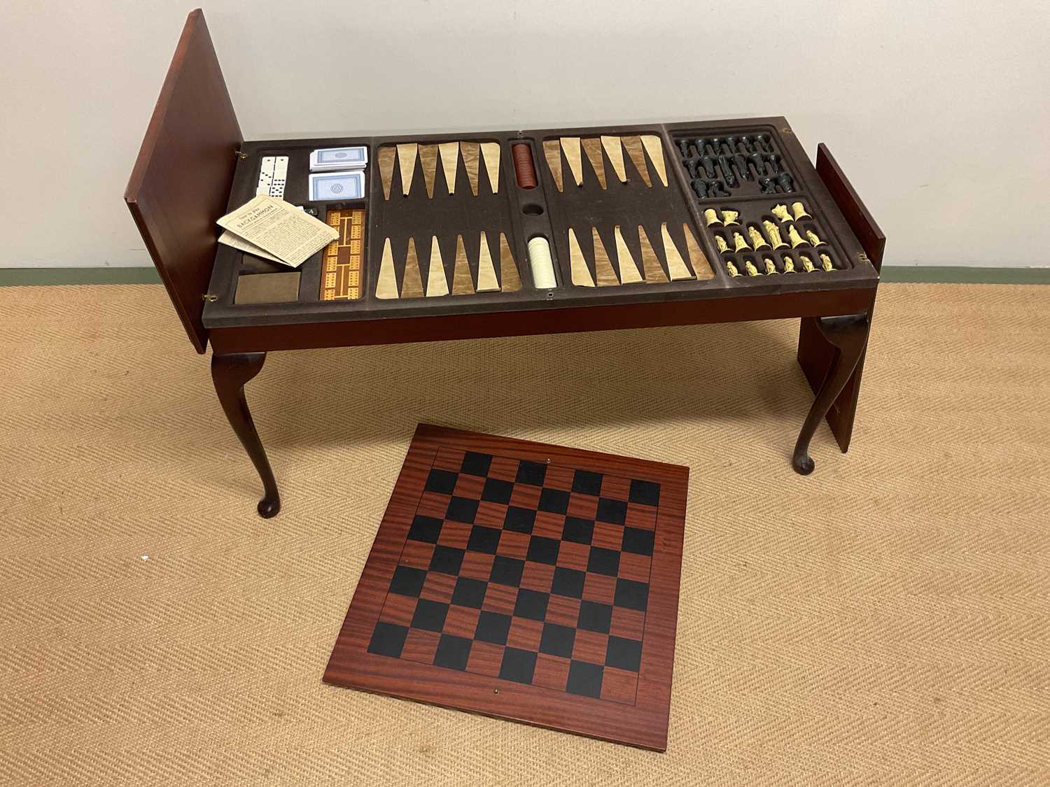 Lot 540 - A coffee table containing chess and