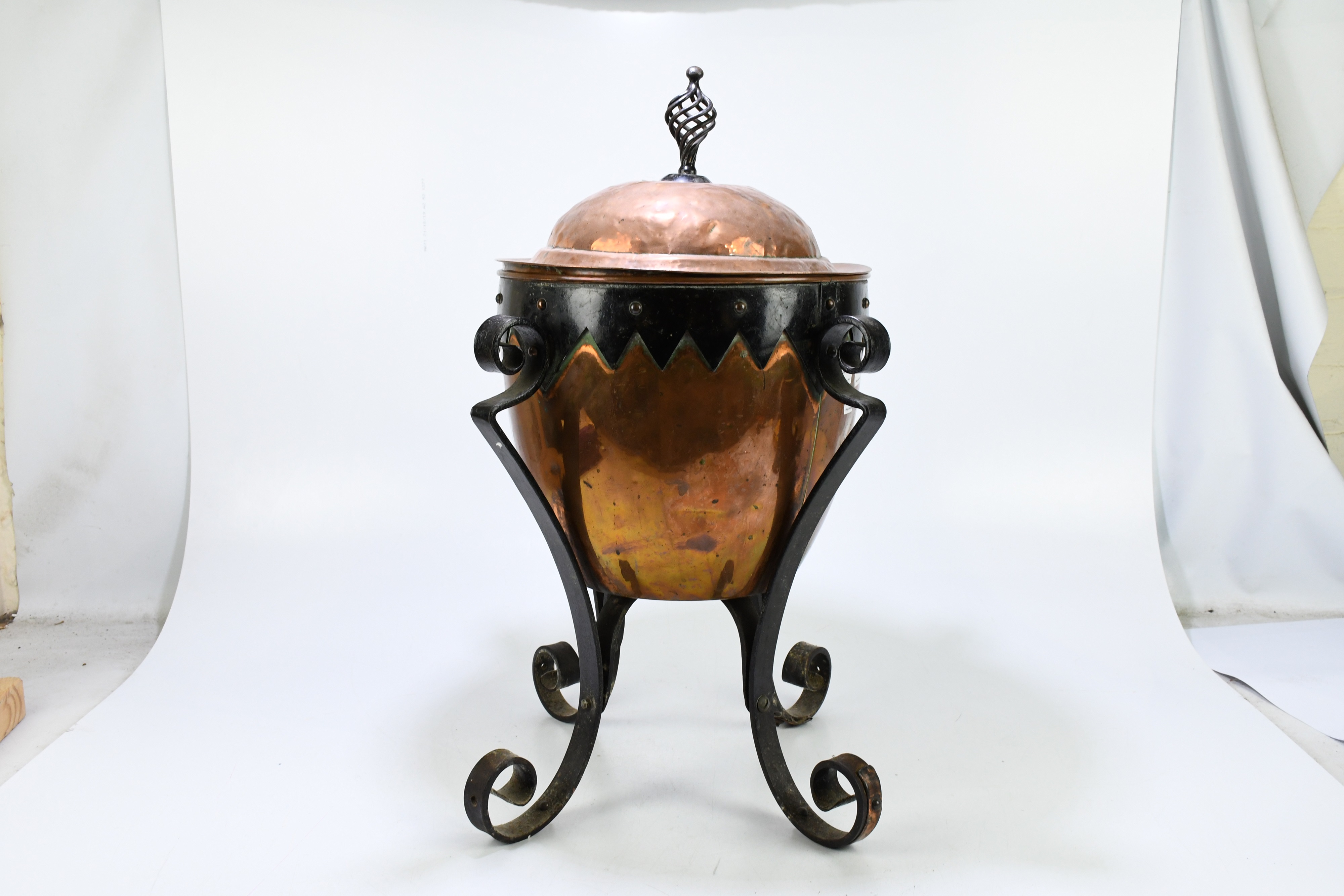 Lot 171 - An Arts and Crafts wrought iron and copper