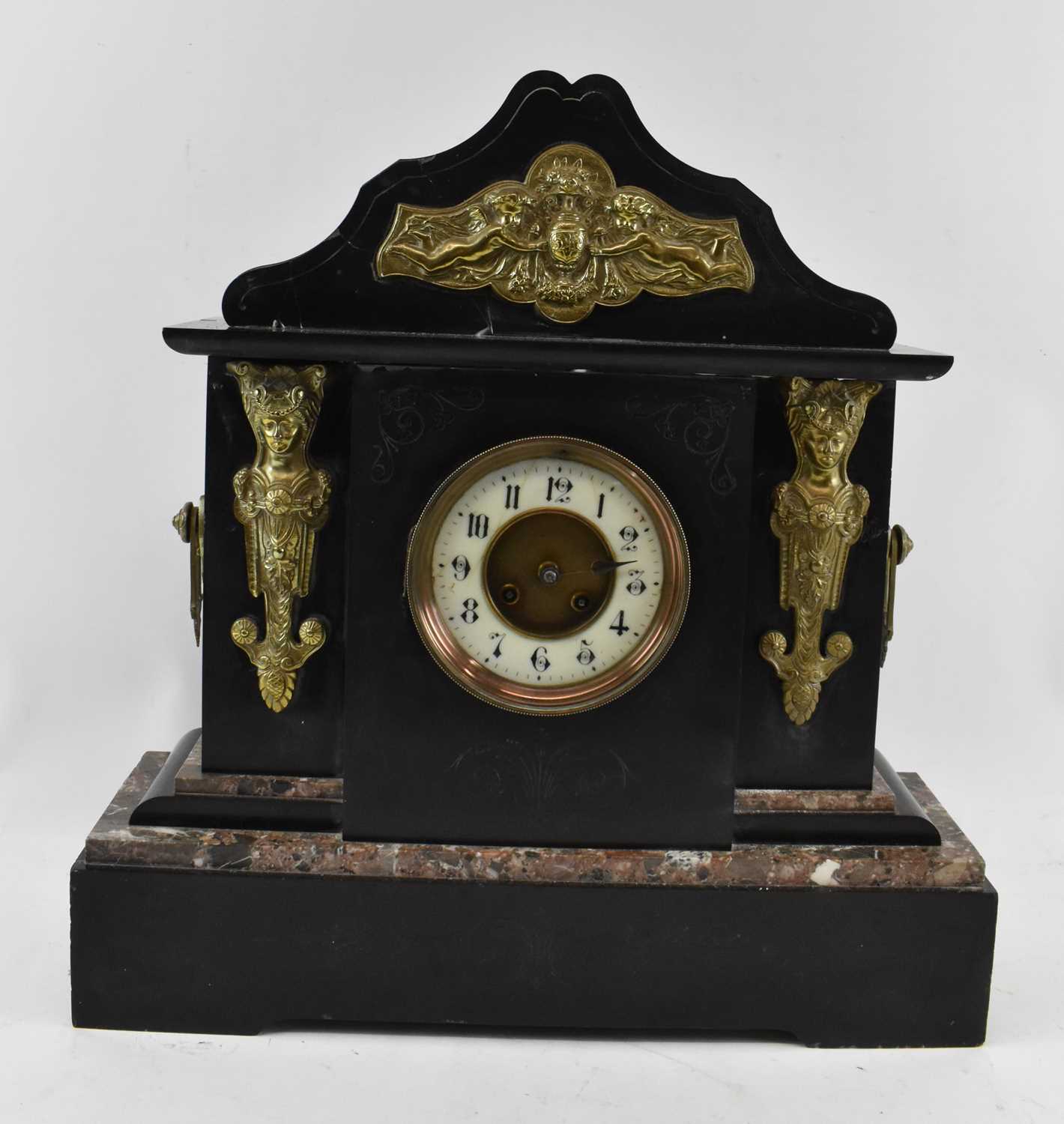 Lot 158 - A late Victorian slate mantel clock set with