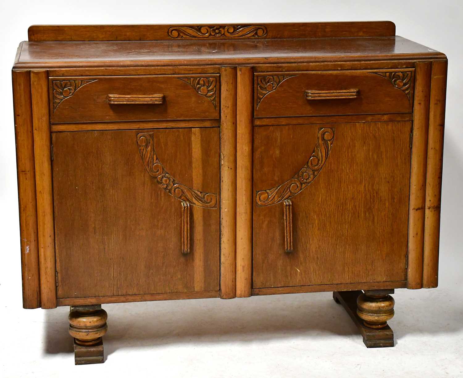 Lot 39 - A c.1930s oak sideboard with two drawers over