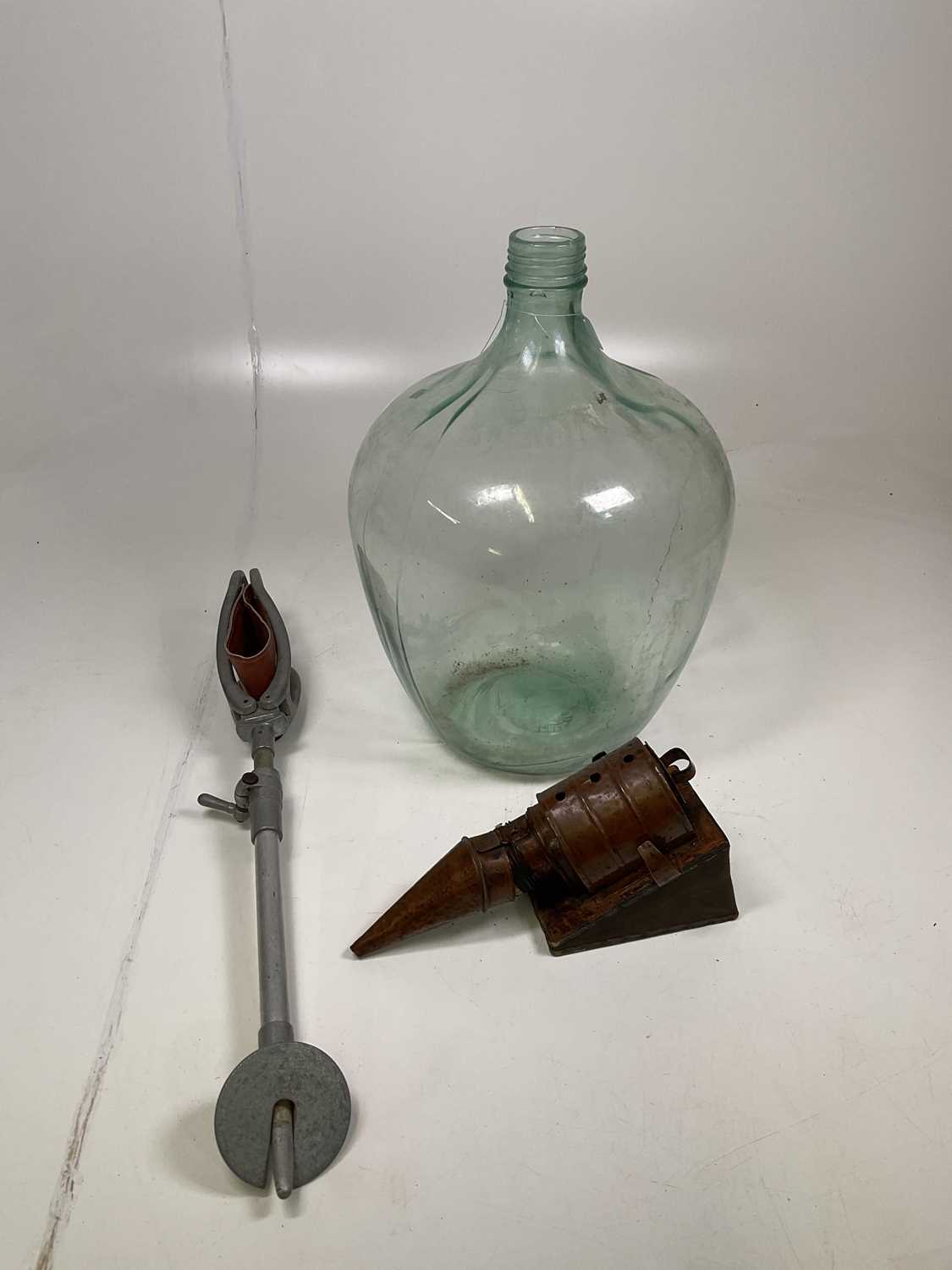 Lot 454 - A vintage glass carboy, height 55cm, a