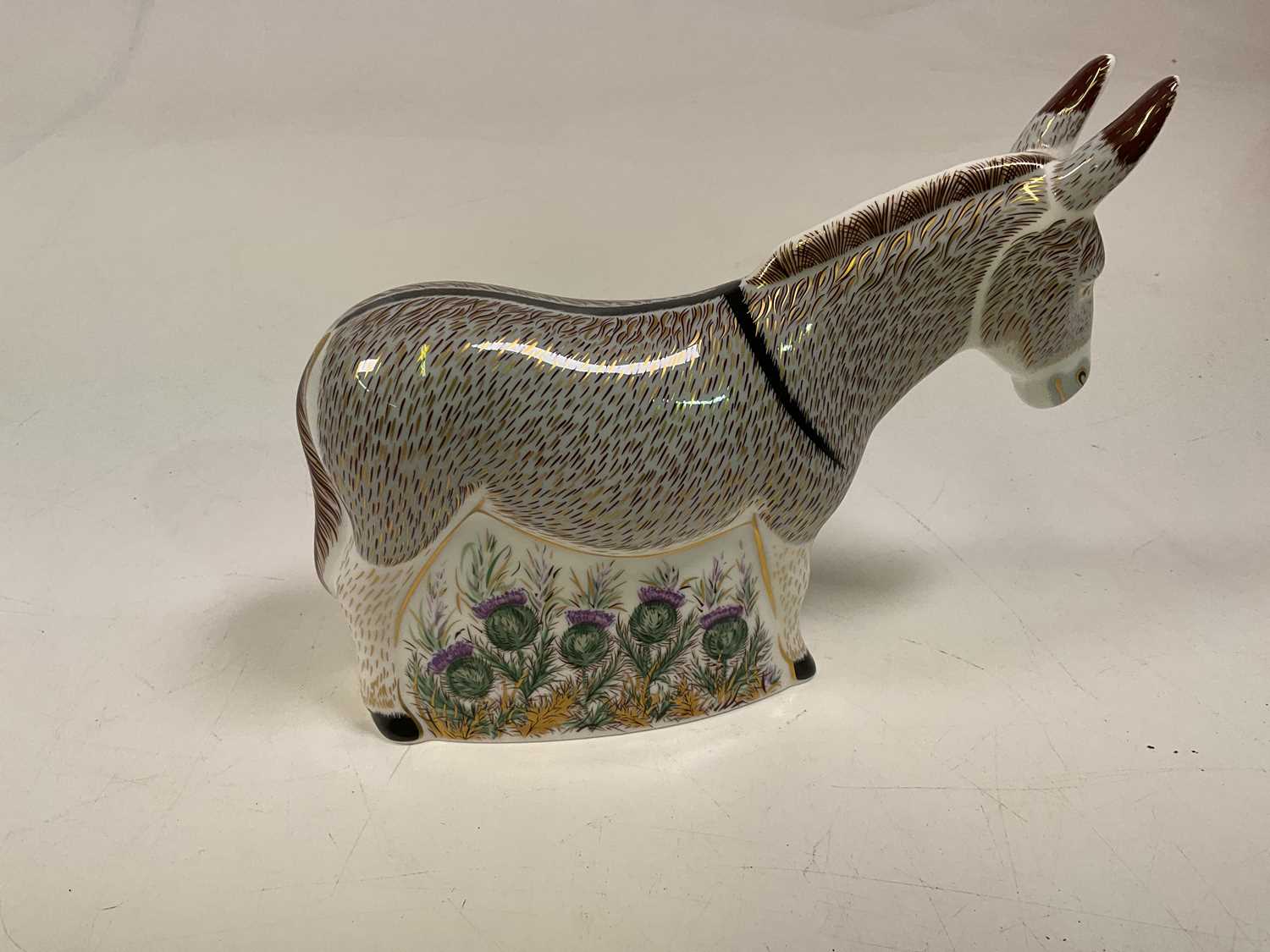Lot 204 - ROYAL CROWN DERBY; a donkey paperweight with