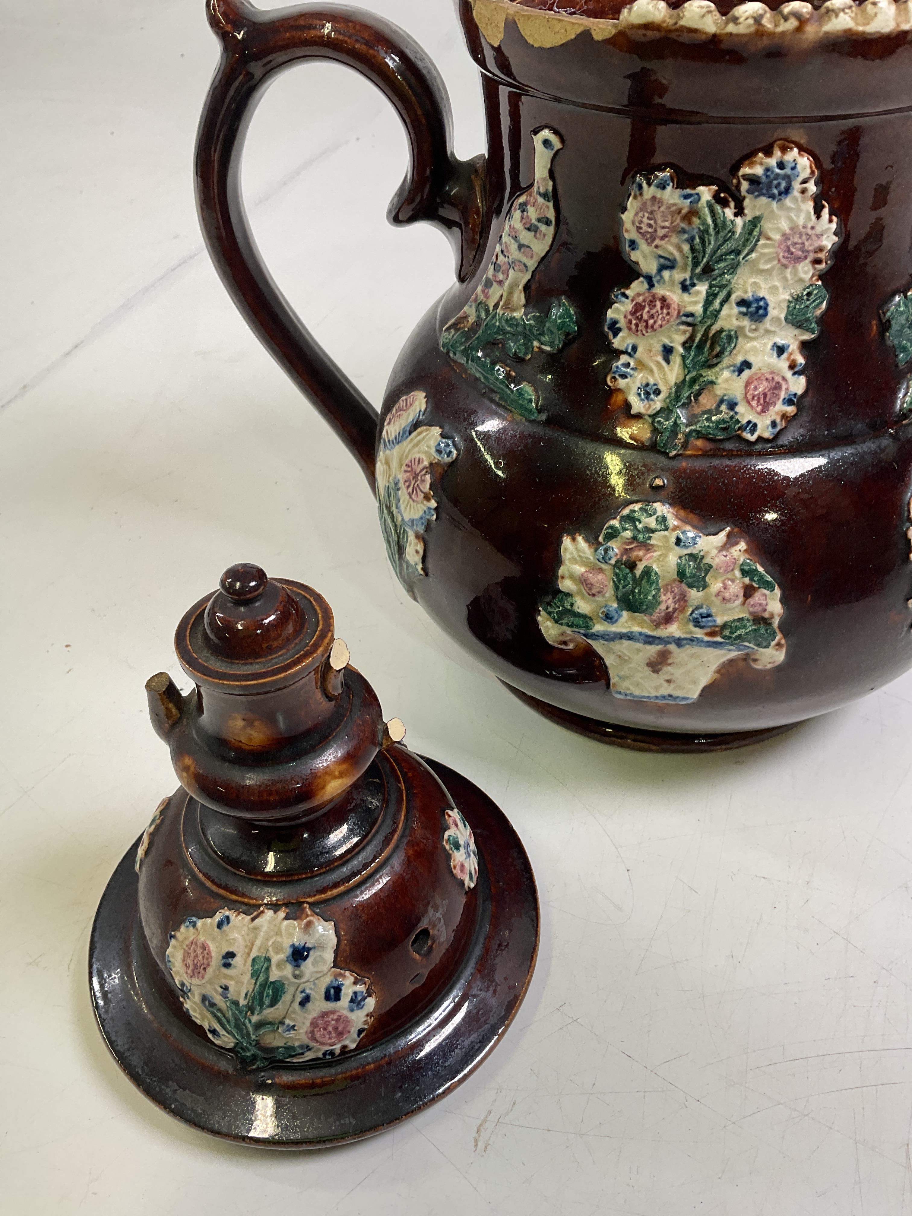 Lot 222 - A 19th centuty bargeware teapot and cover