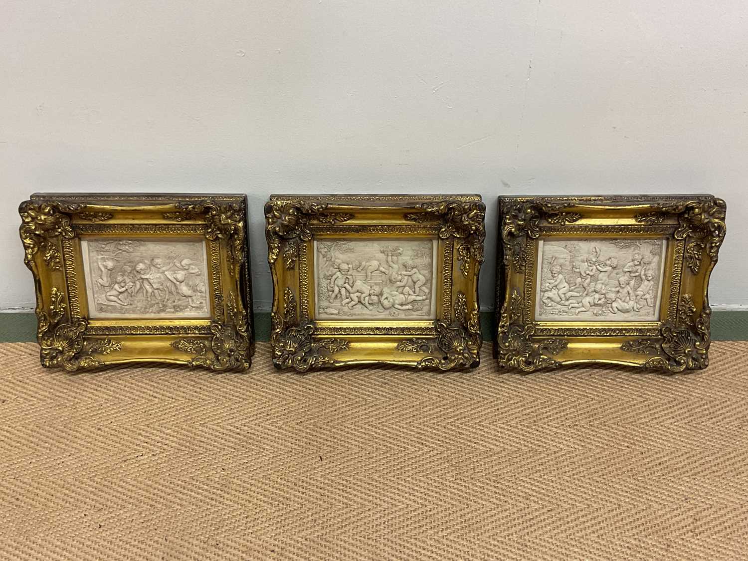 Lot 243 - Three reproduction rectangular plaques,