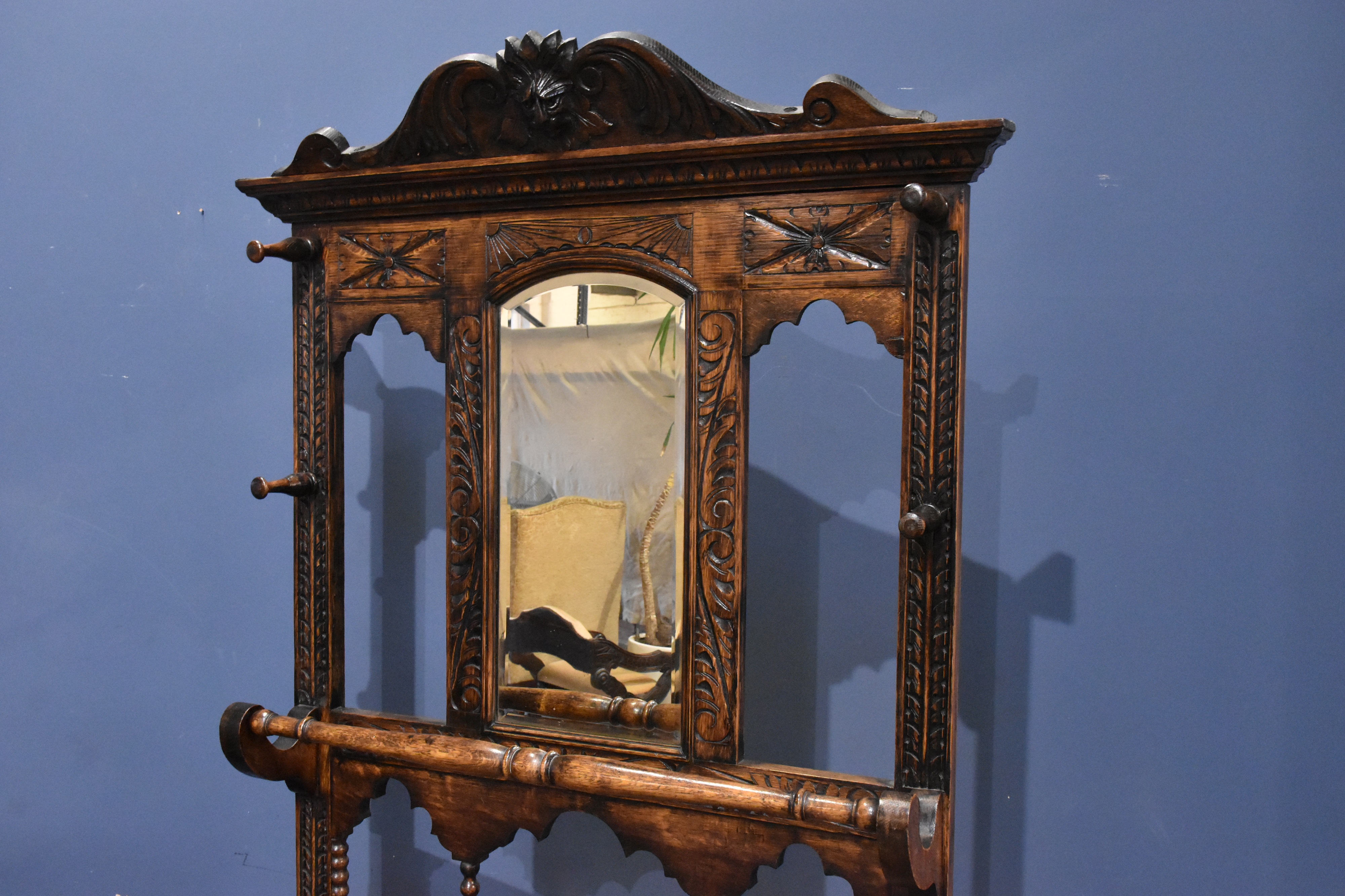Lot 26 - A 1920s carved oak hall stand with mask head