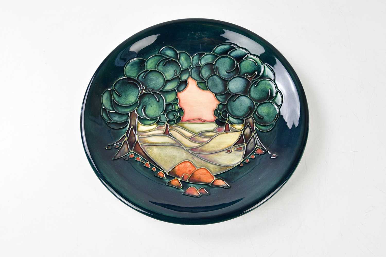 Lot 1302 - MOORCROFT; a modern plate decorated with a