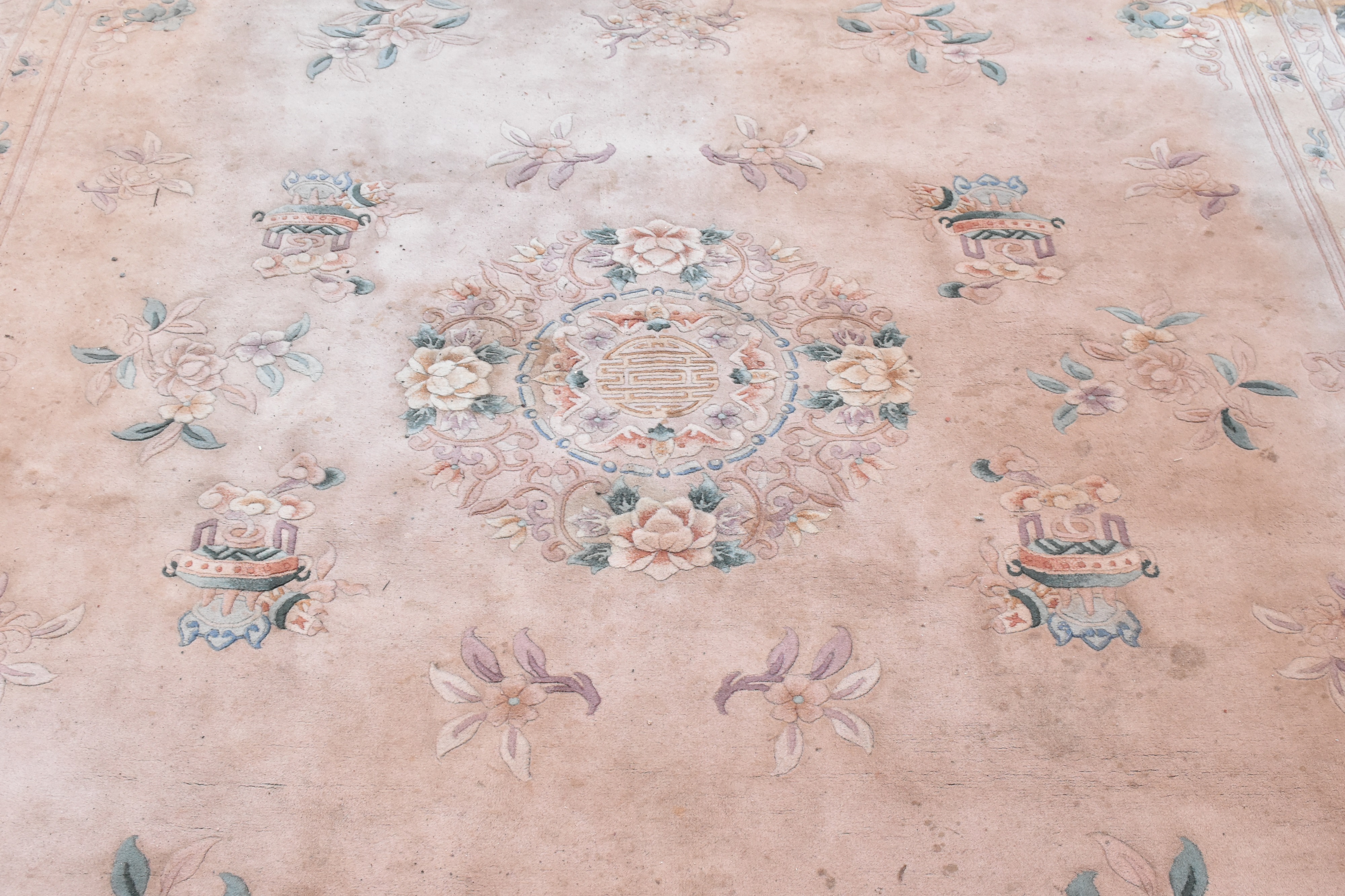 Lot 356 - A Chinese wool carpet, worked with an floral