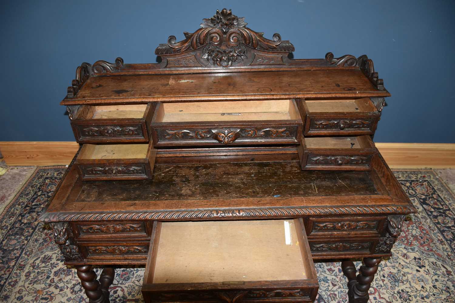 Lot 24 - A 19th century Flemish style carved oak desk