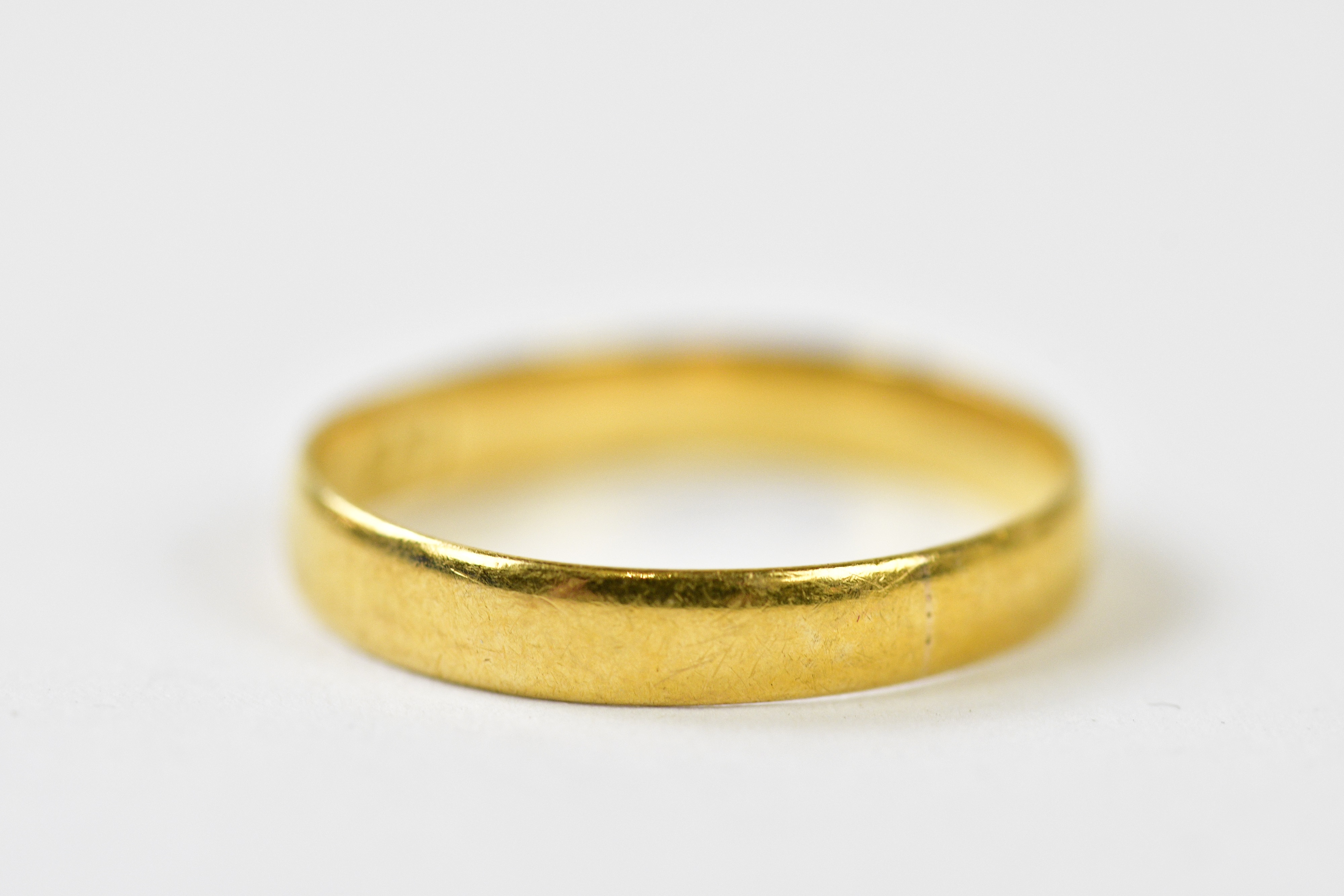 Lot 260 - Two 22ct yellow gold wedding bands, both