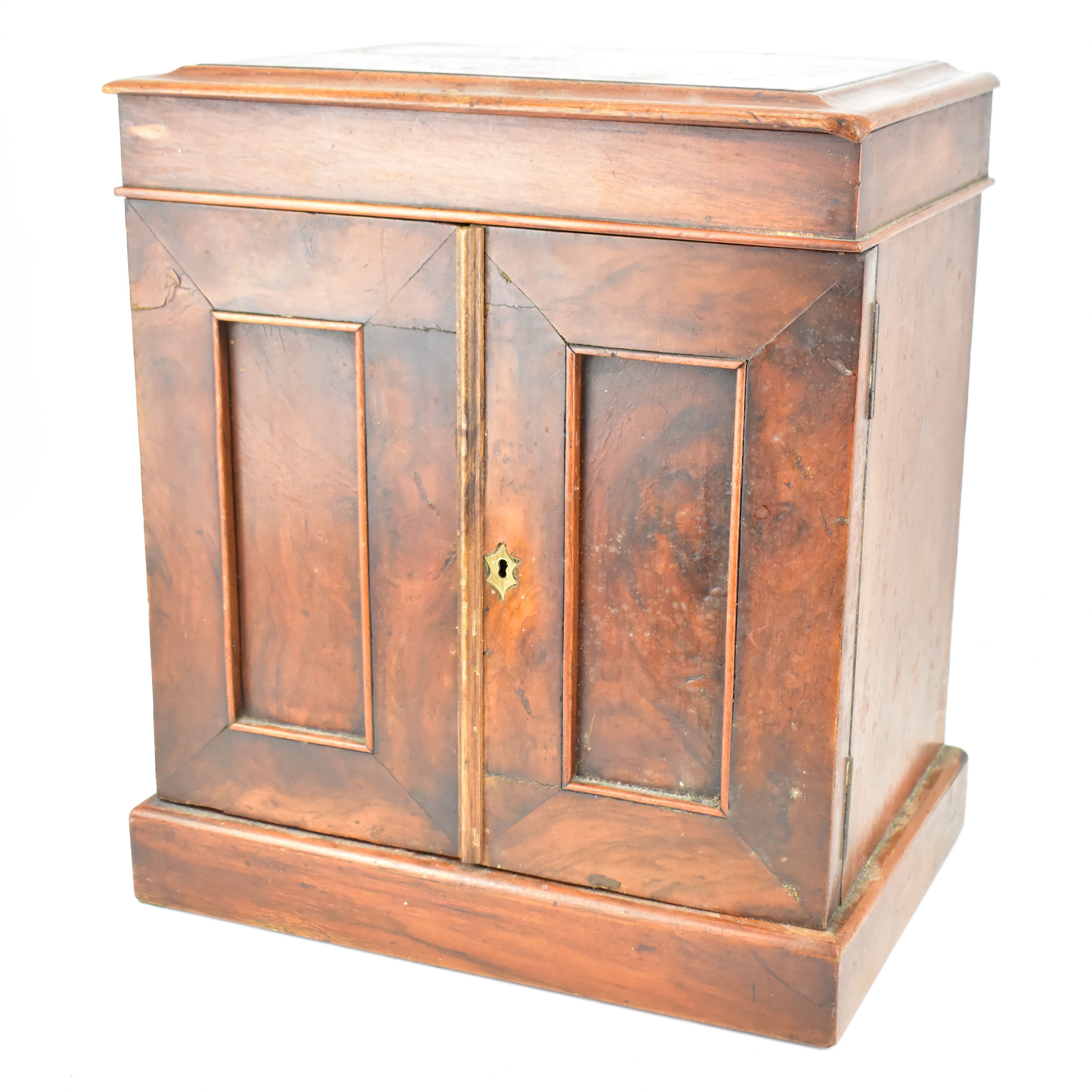 Lot 21 - A mahogany table-top chest of three drawers