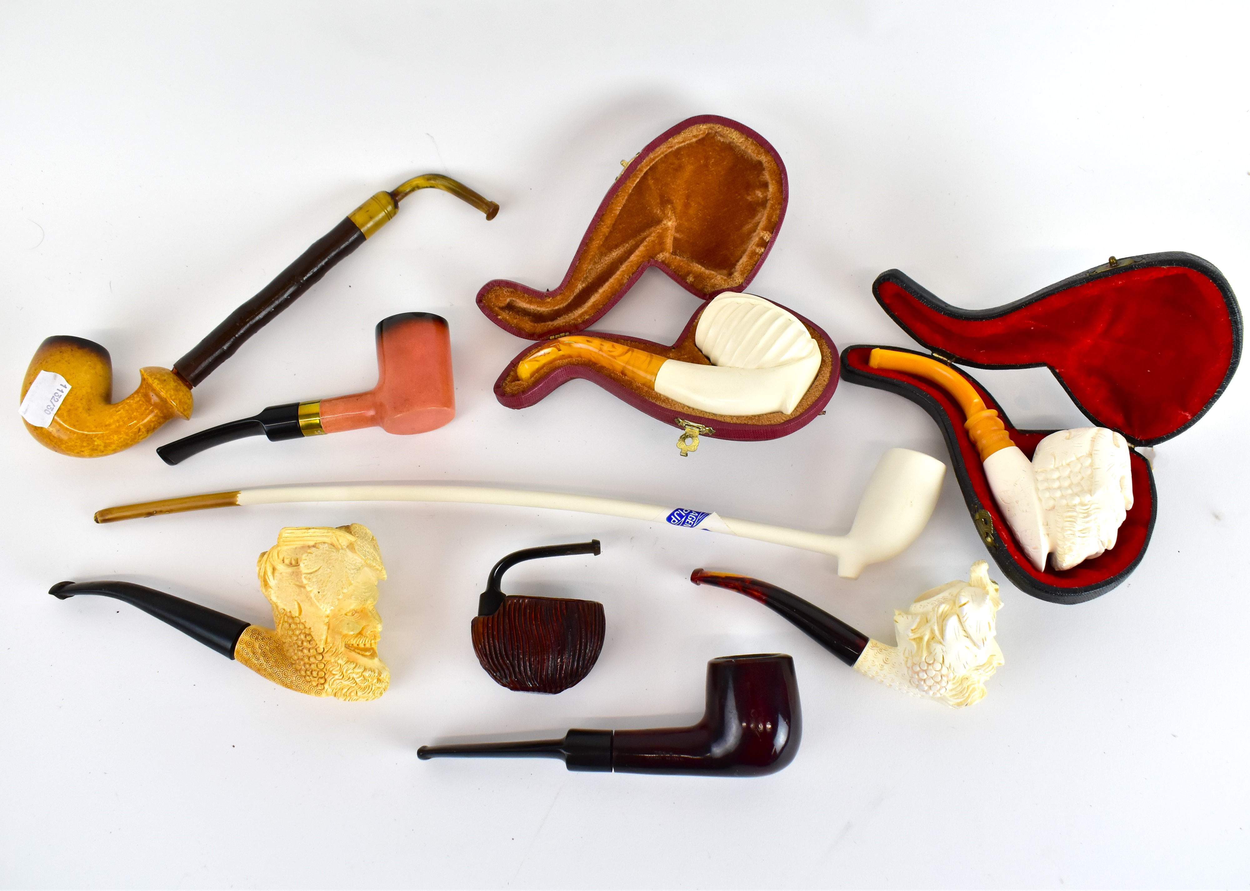 Lot 315 - A group of eight pipes including two leather