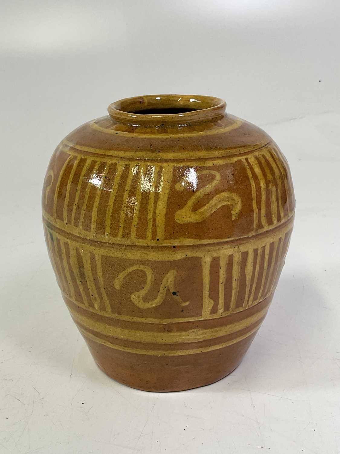 Lot 214 - An early 20th century slipware pottery vase