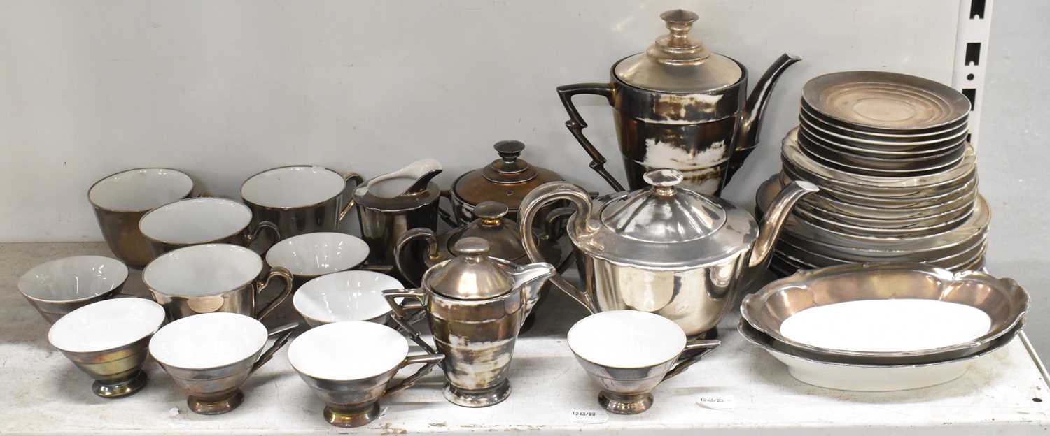 Lot 521 - A foreign Art Deco style silvered part tea