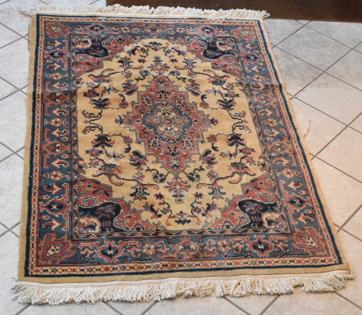 Lot 133 - A Persian red and cream ground carpet with