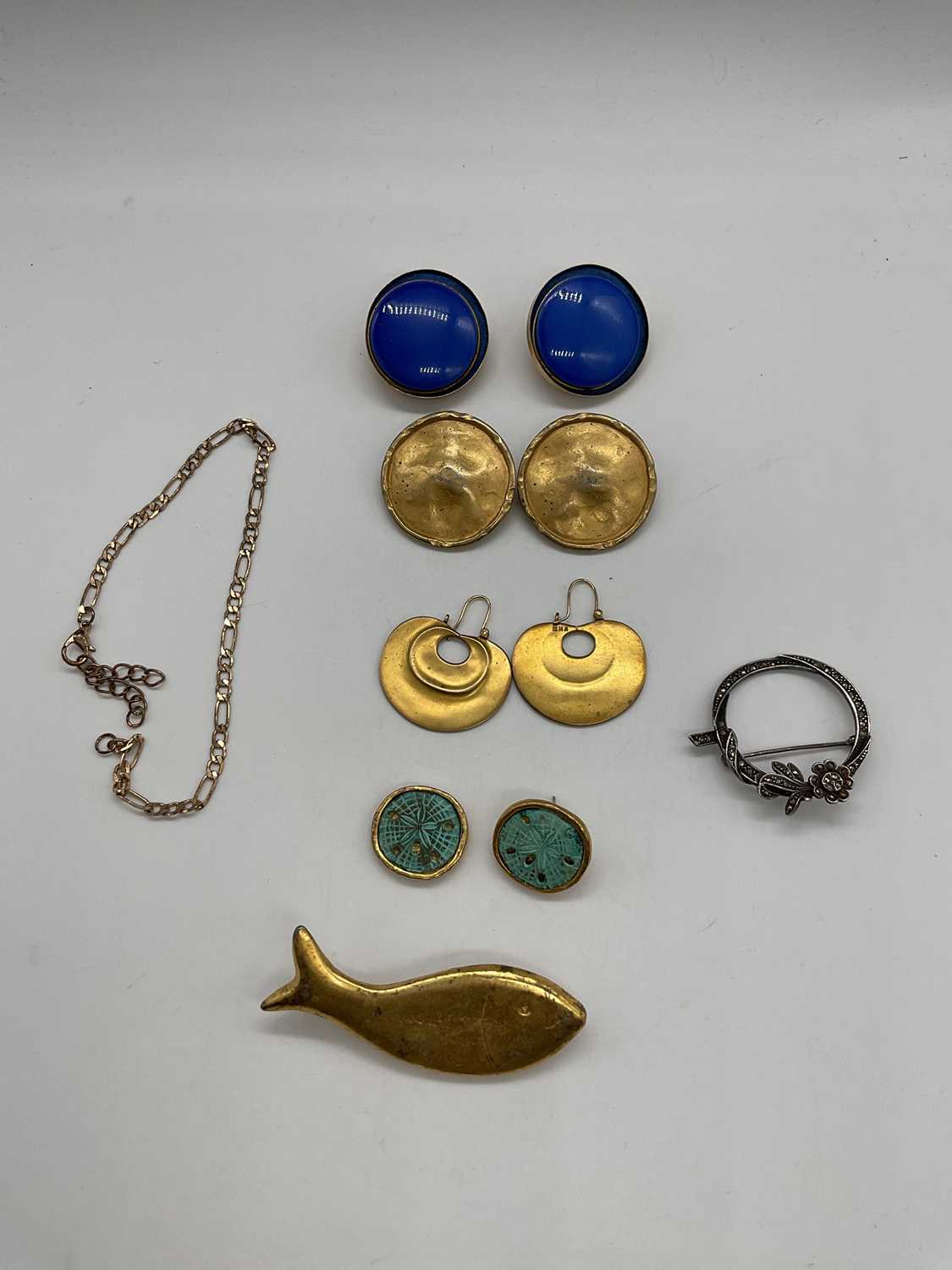 Lot 529 - SPHINX; a pair of gold effect clip-on