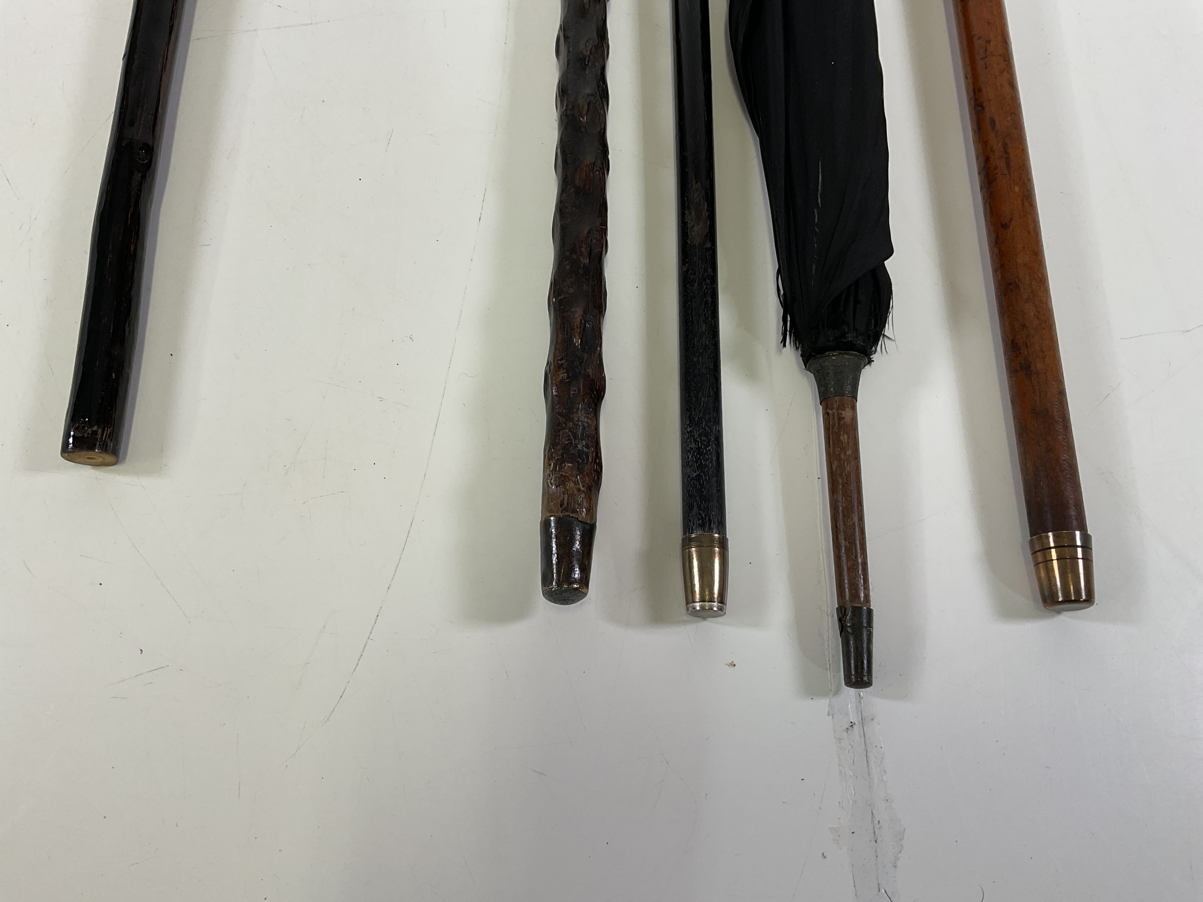 Lot 60 - A collection of walking sticks comprising two