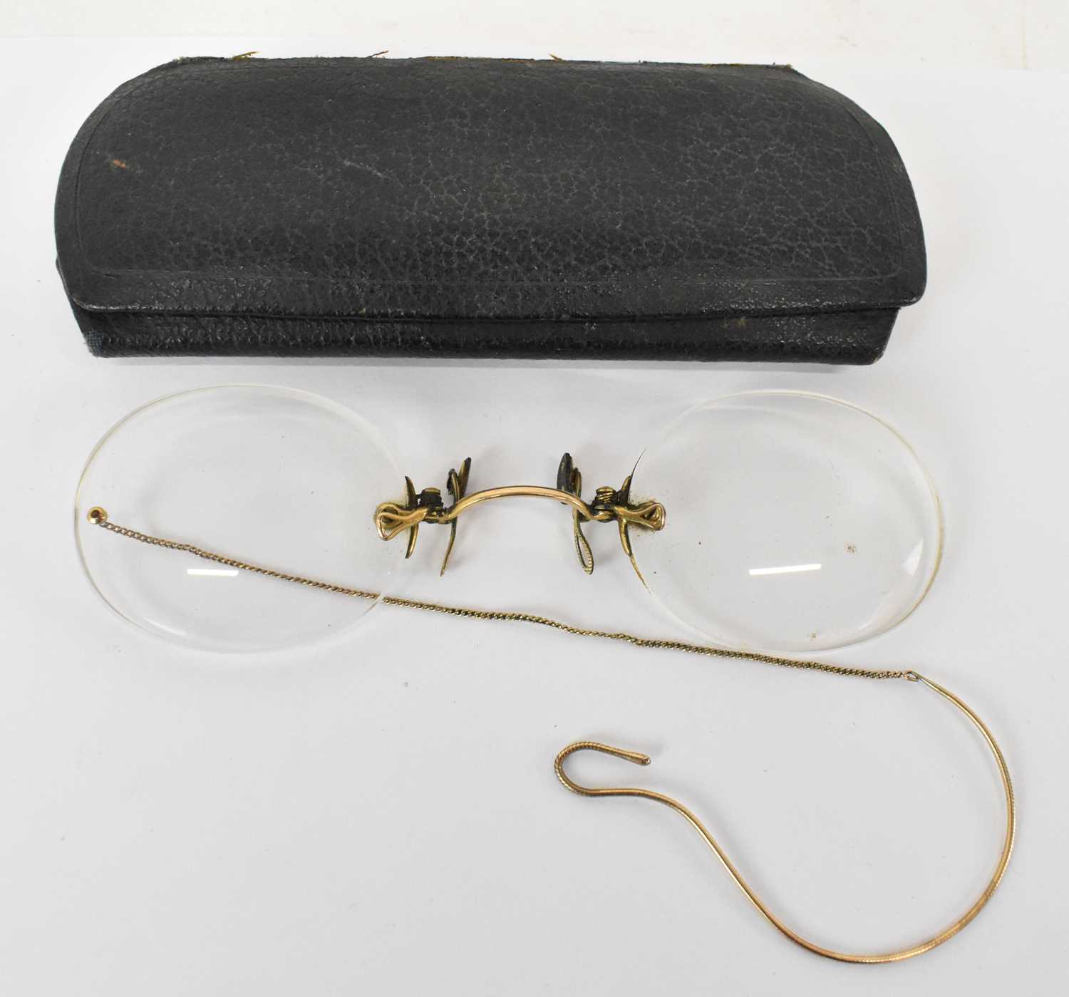 Lot 847 - A pair of yellow metal mounted spectacles