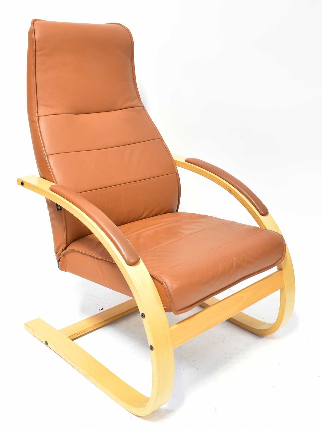 Lot 18 - A modern brown leather easy chair with beech