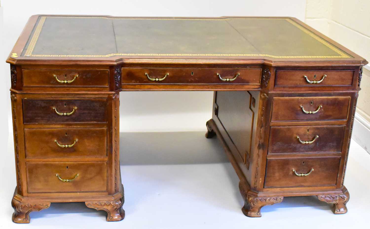 Lot 34 - A large reproduction mahogany partner's desk