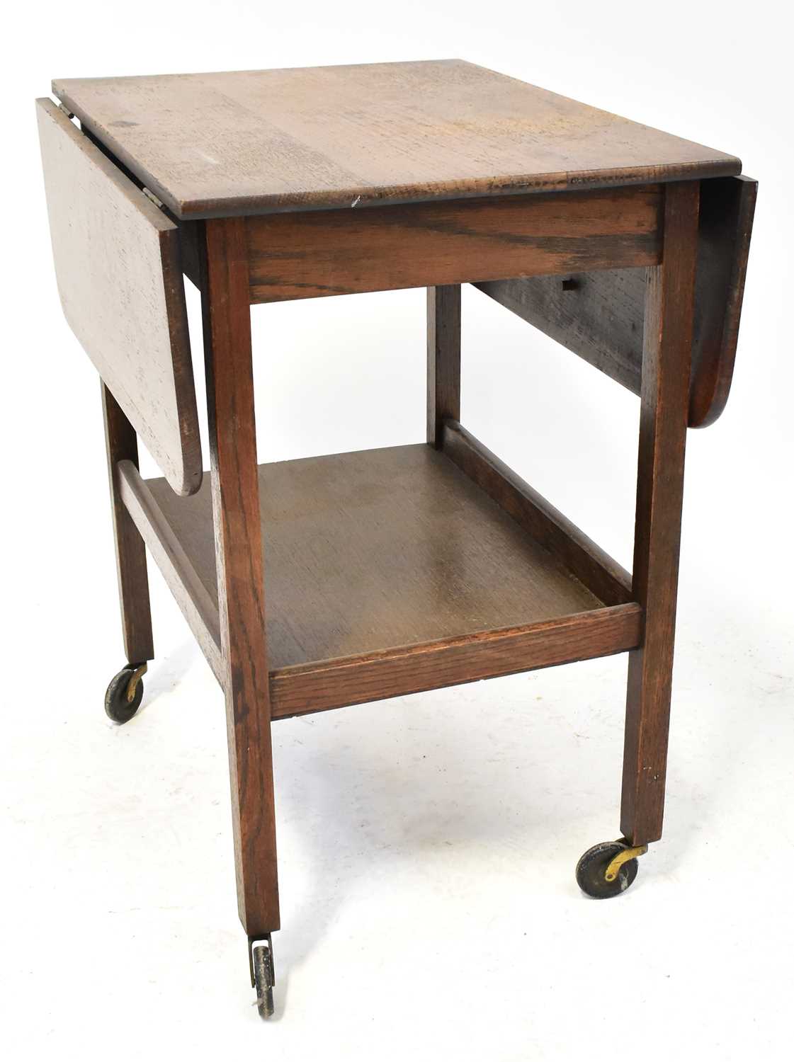 Lot 12 - ERCOL; a dark elm coffee table with