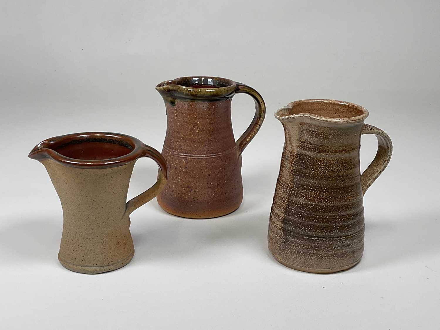 Lot 187 - MUCHELNEY POTTERY; two stoneware jugs with