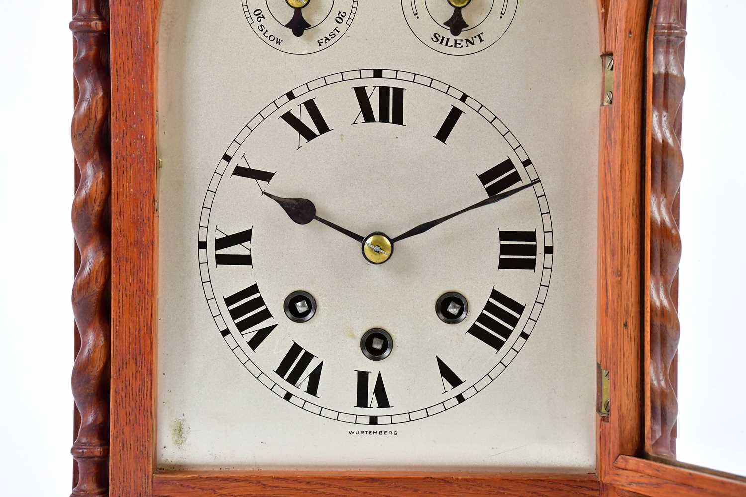 Lot 2131 - A 1920s oak cased mantel clock, with arched