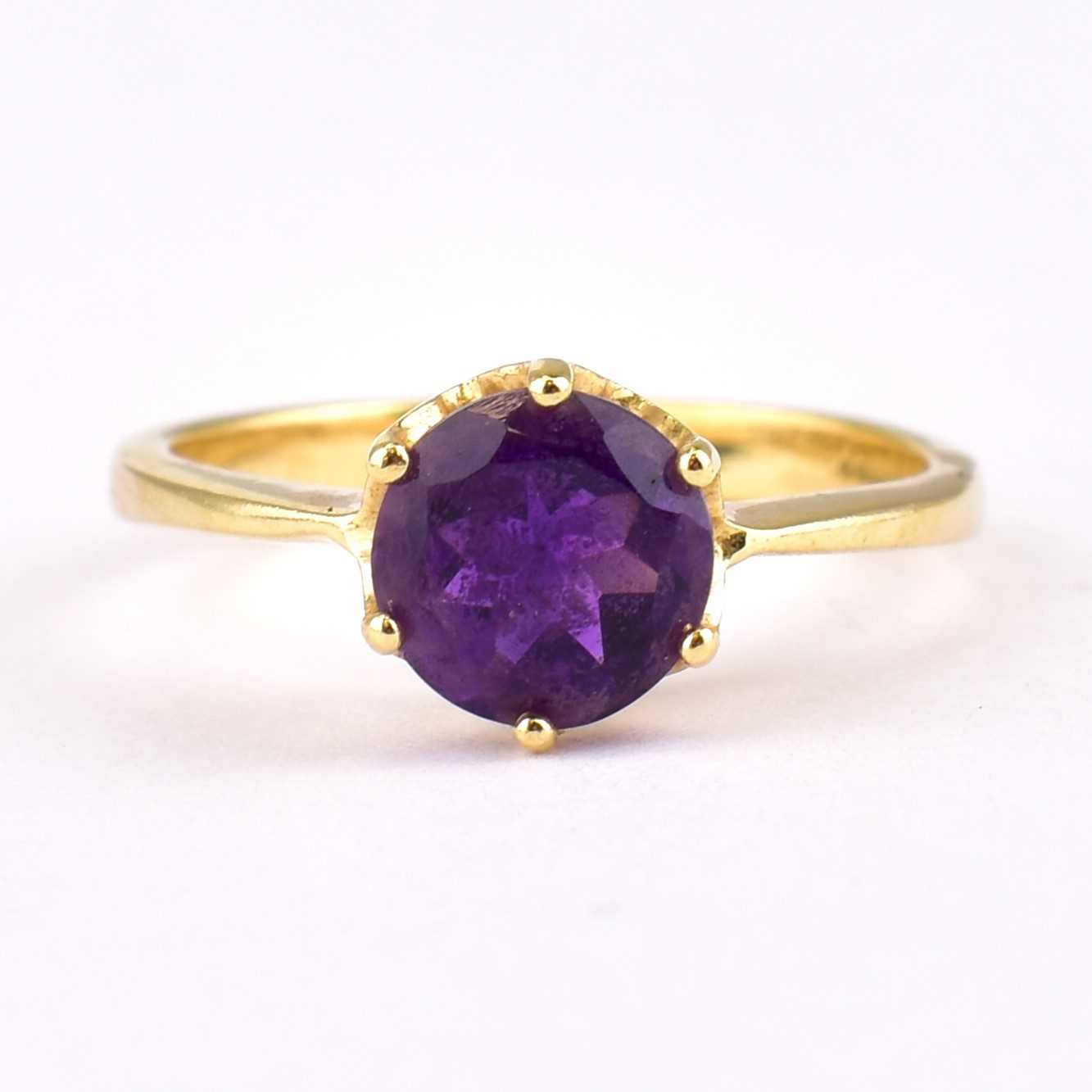 Lot 747 - A 14ct gold single claw set amethyst ring,