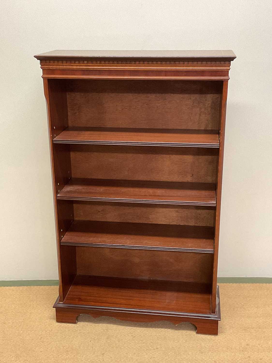 Lot 709 - A reproduction open bookcase with three