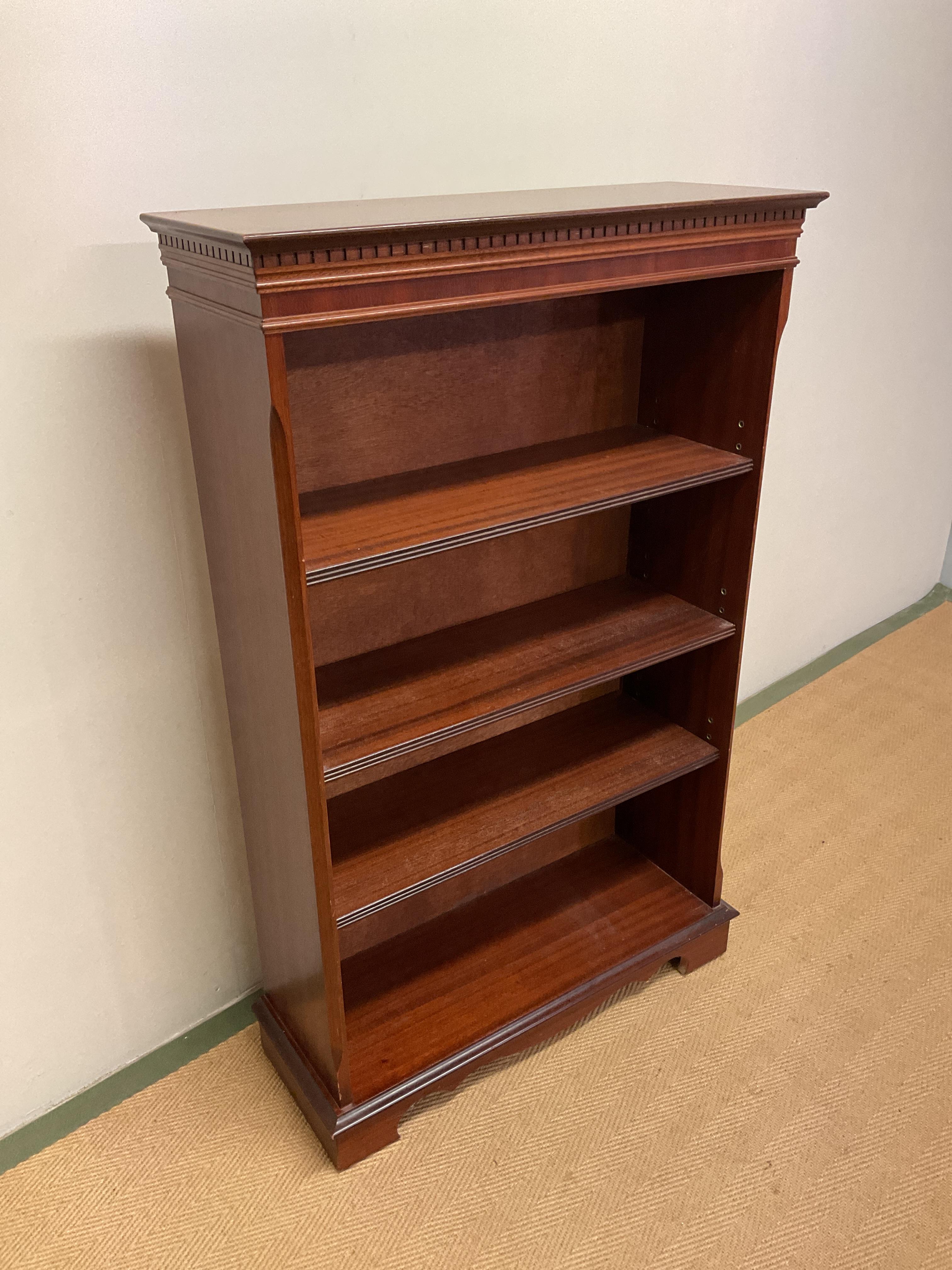 Lot 709 - A reproduction open bookcase with three