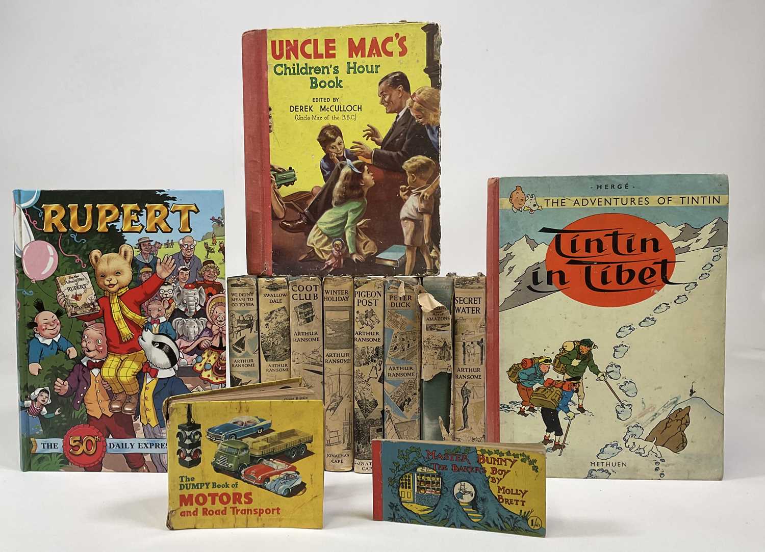 Lot 391 - ARTHUR RANSOME; a collection of eight titles