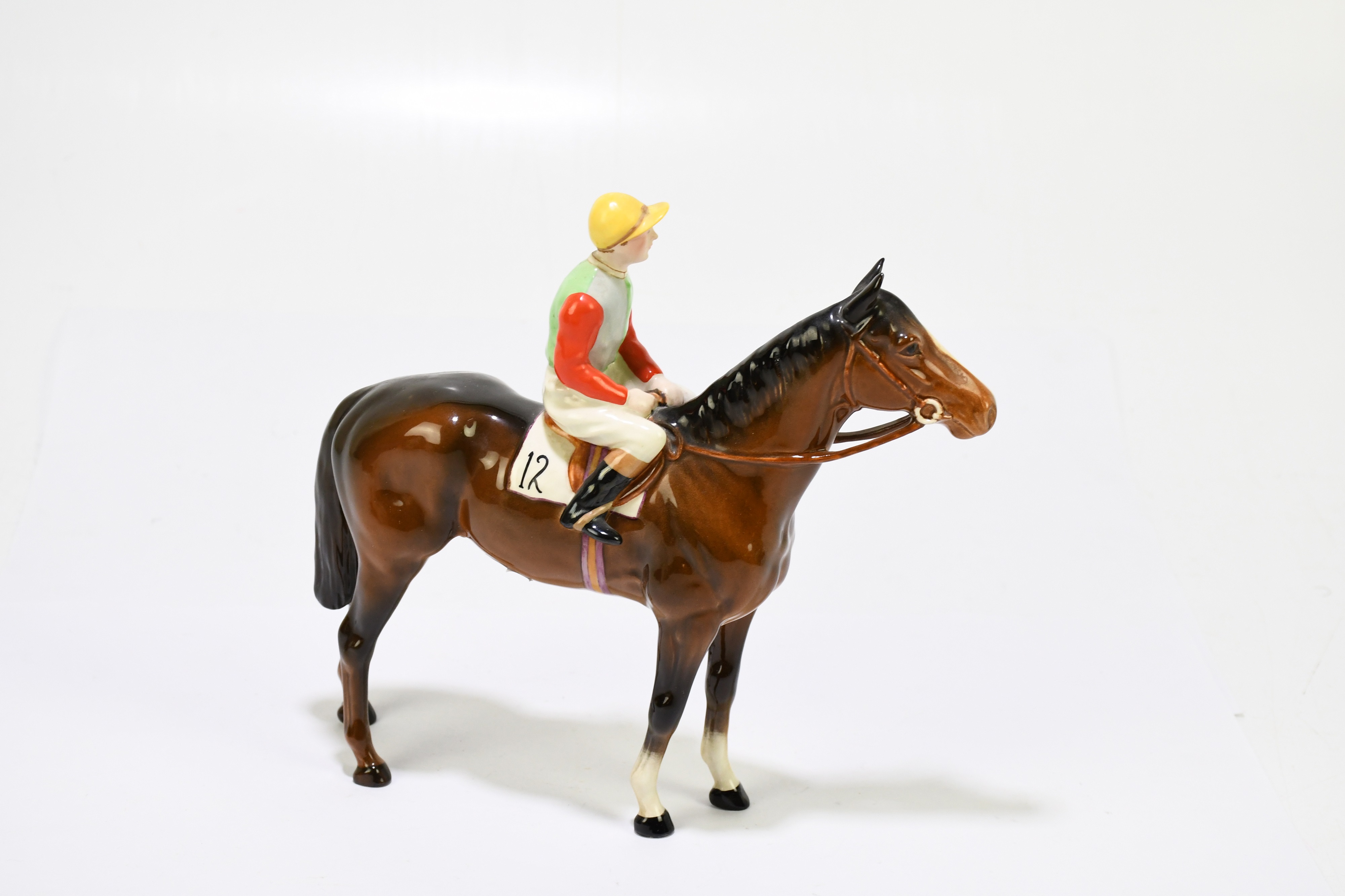 Lot 572 - BESWICK; a model of jockey on horseback,