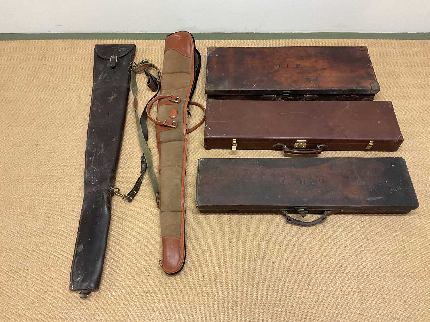 Lot 58 - Three leather gun cases, one labelled